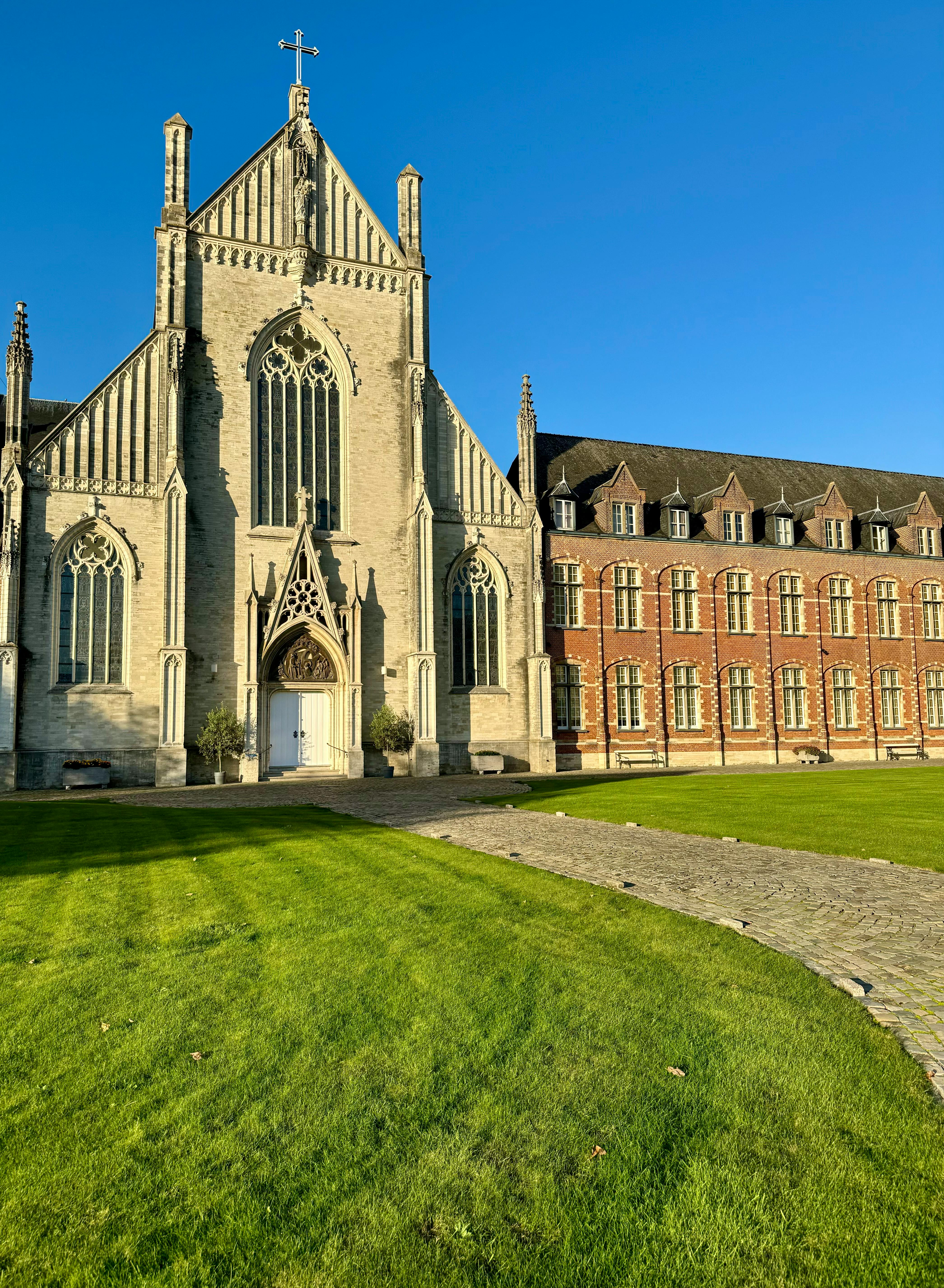 Gothic Cathedral with Adjacent Brick Building · Free Stock Photo
