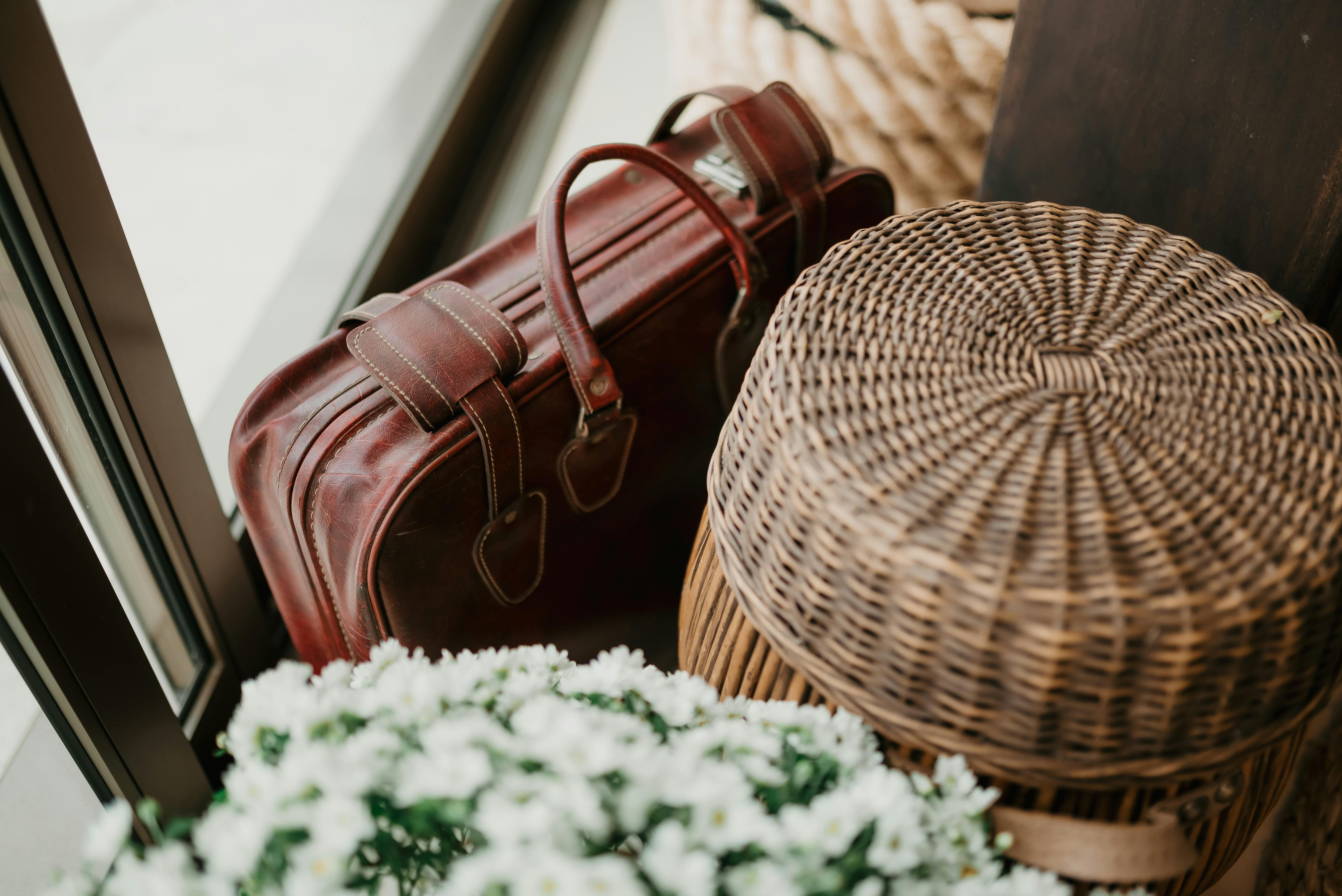 Rustic Travel Setup with Leather Bag and Basket · Free Stock Photo