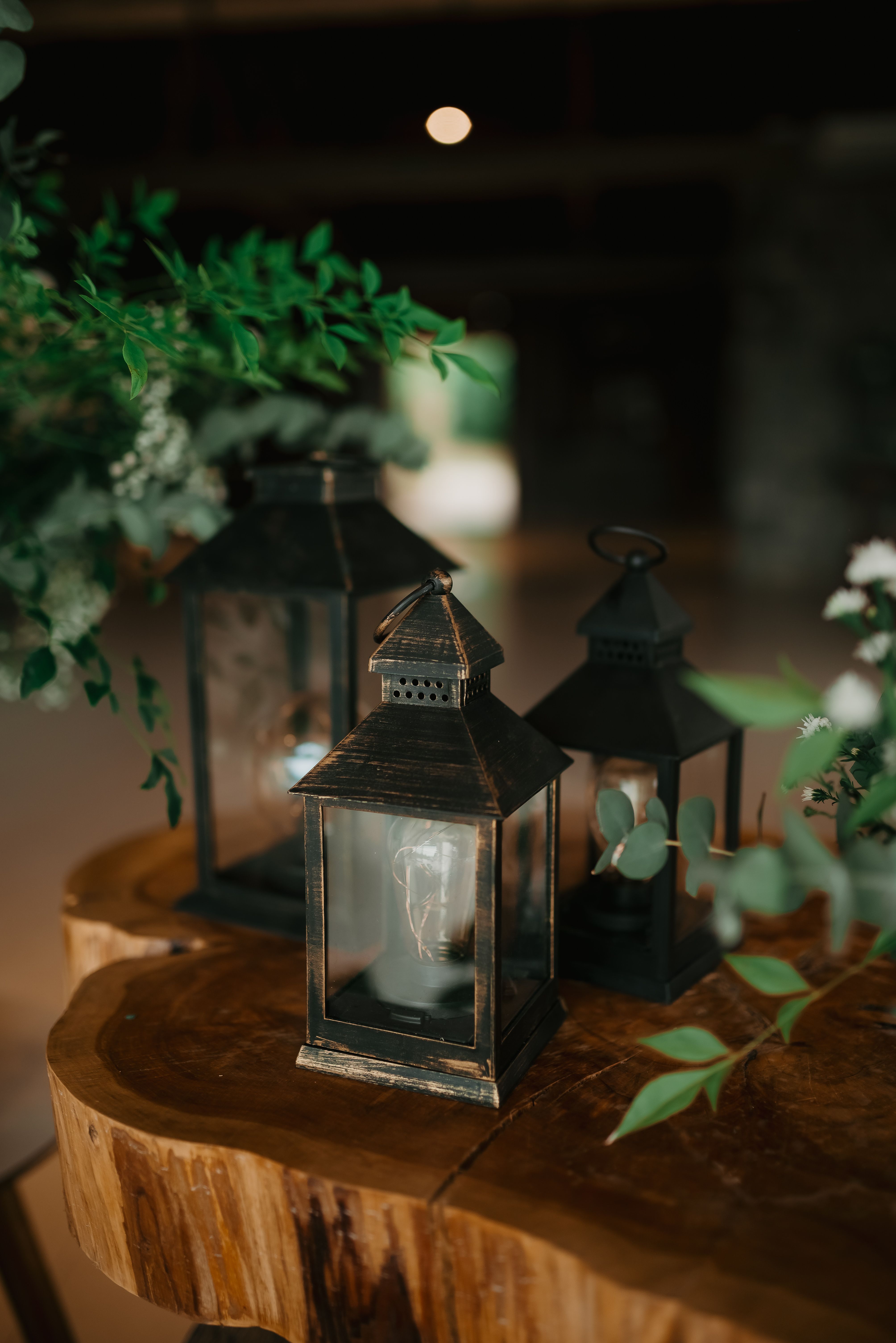 Elegant Rustic Lanterns on Wooden Table with Greenery · Free Stock Photo