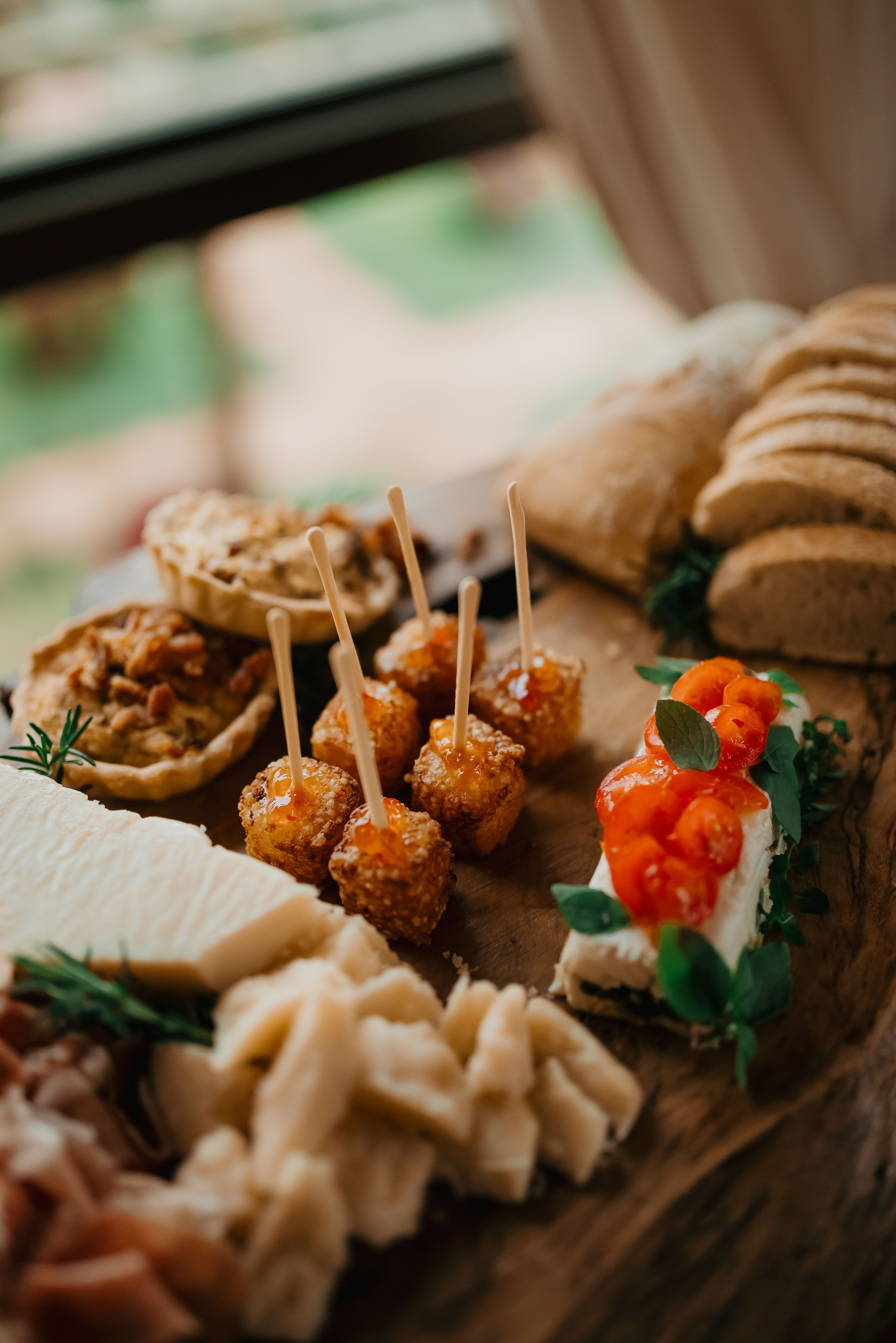 Gourmet Cheese and Bread Platter with Appetizers · Free Stock Photo