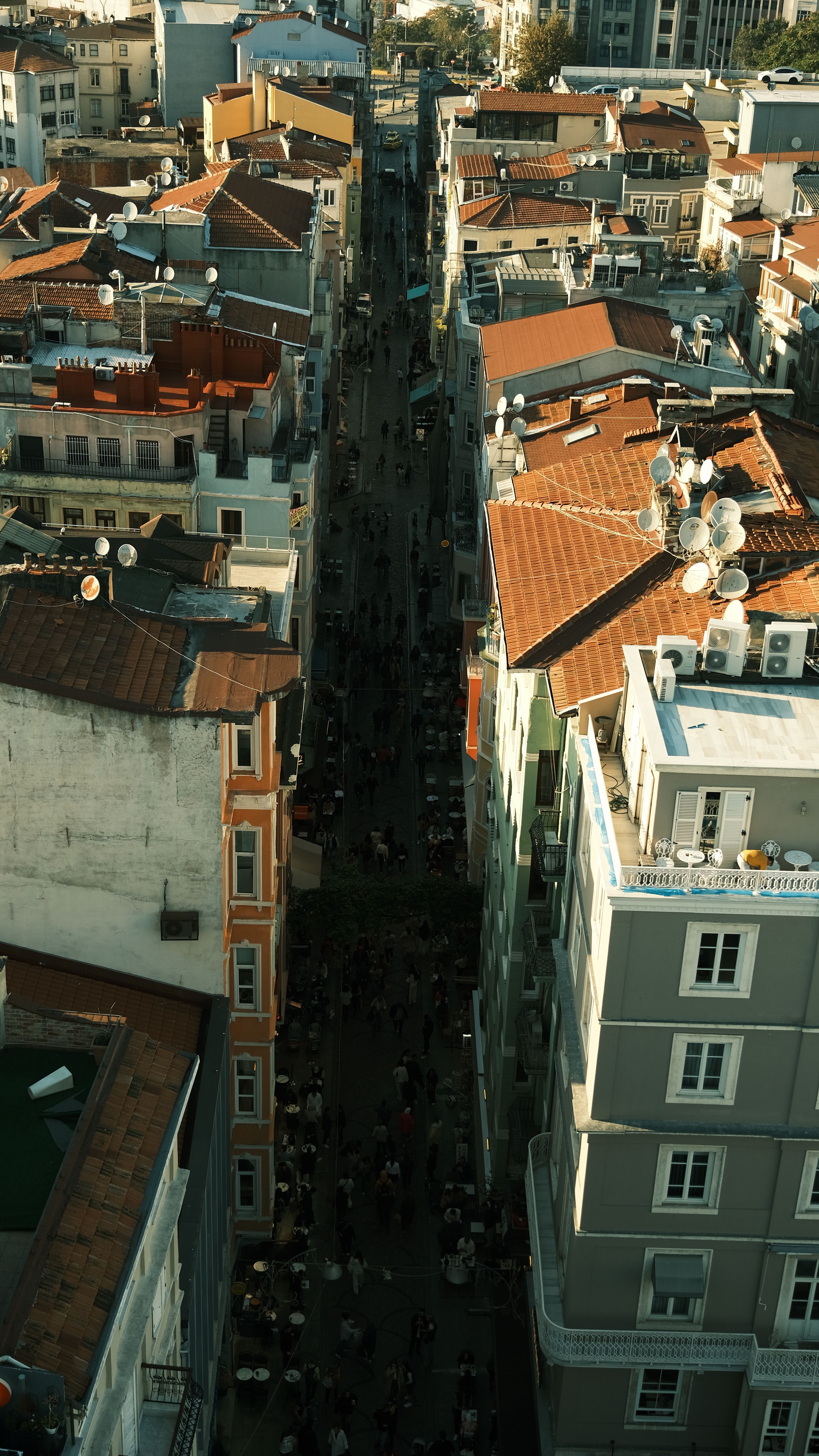 Aerial View of Crowded Street with Rooftop Perspective · Free Stock Photo