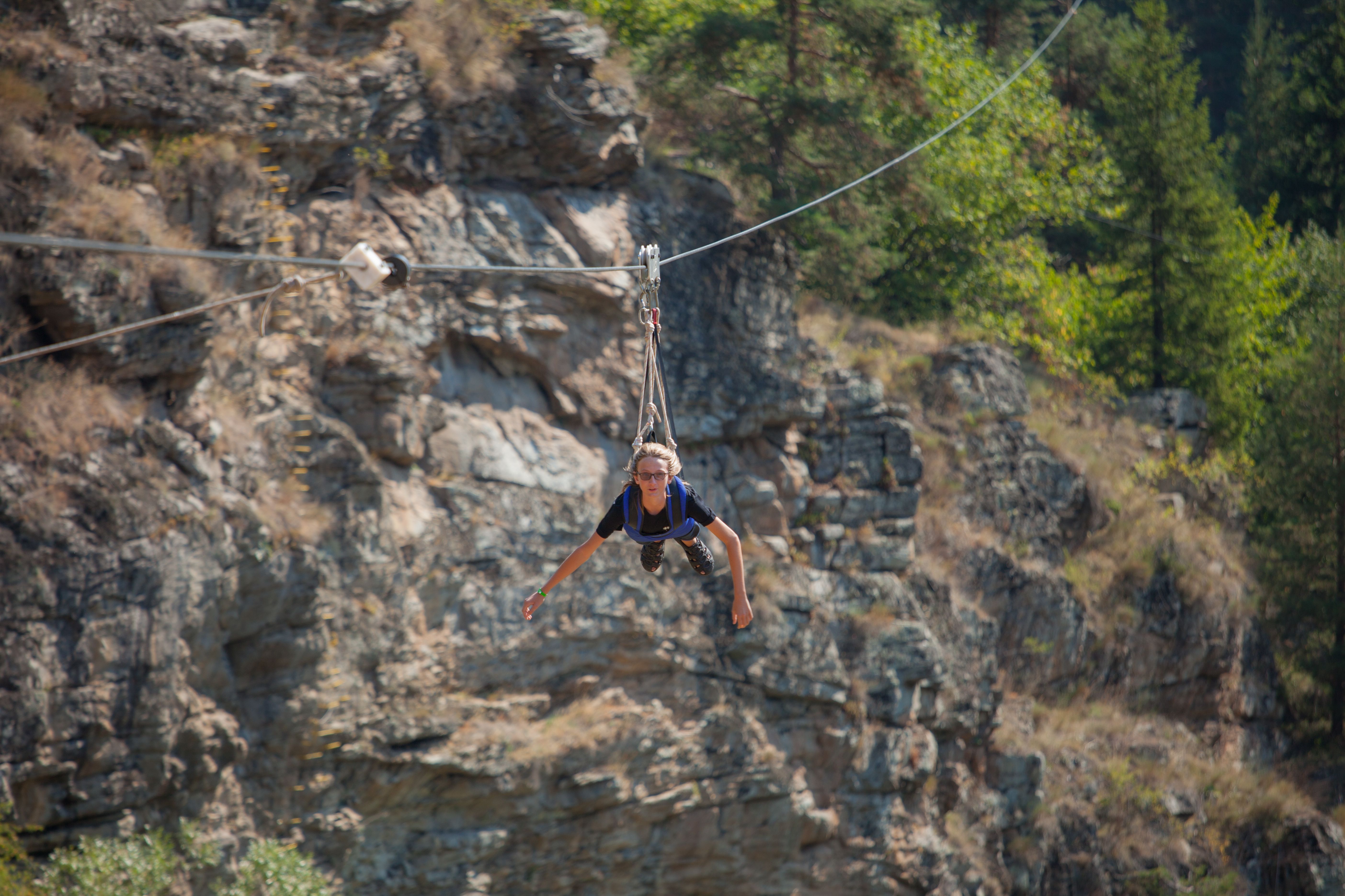 Exciting Zipline Adventure Over Rocky Canyon · Free Stock Photo