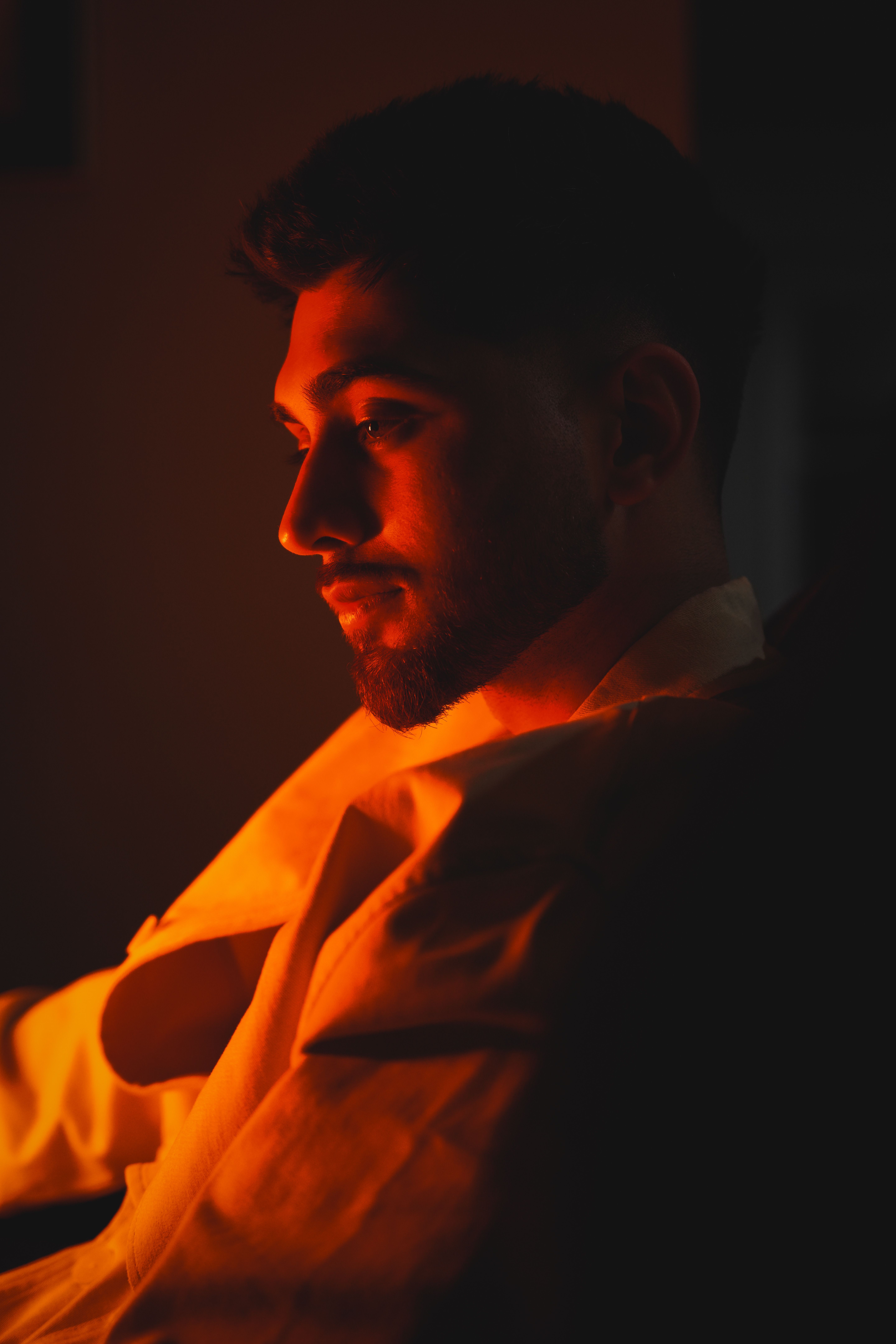 Thoughtful Man in Warm Portrait Lighting · Free Stock Photo
