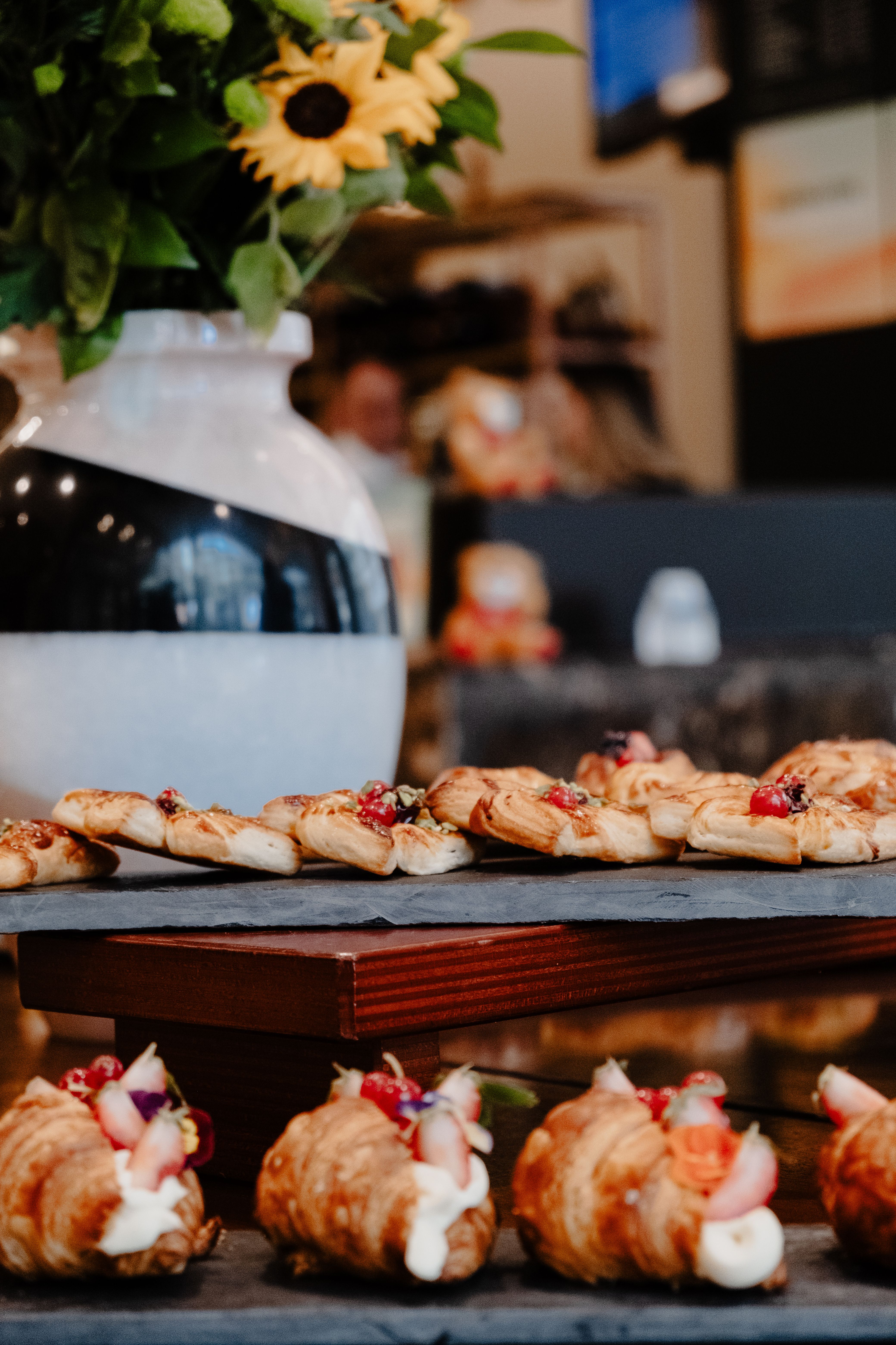 Delicious Pastries Displayed in Cozy Cafe Setting · Free Stock Photo