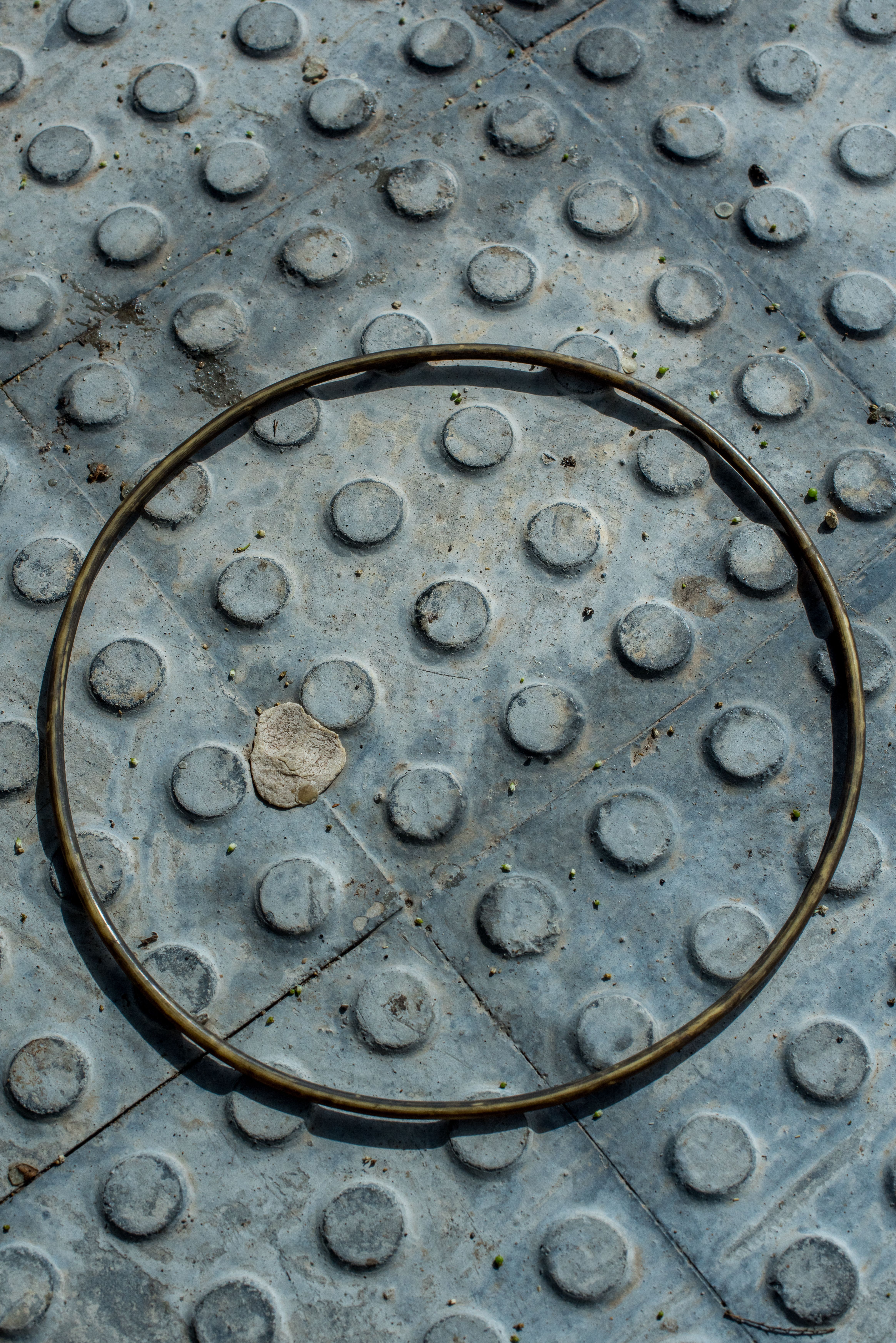 Circular Object on Textured Metal Surface · Free Stock Photo