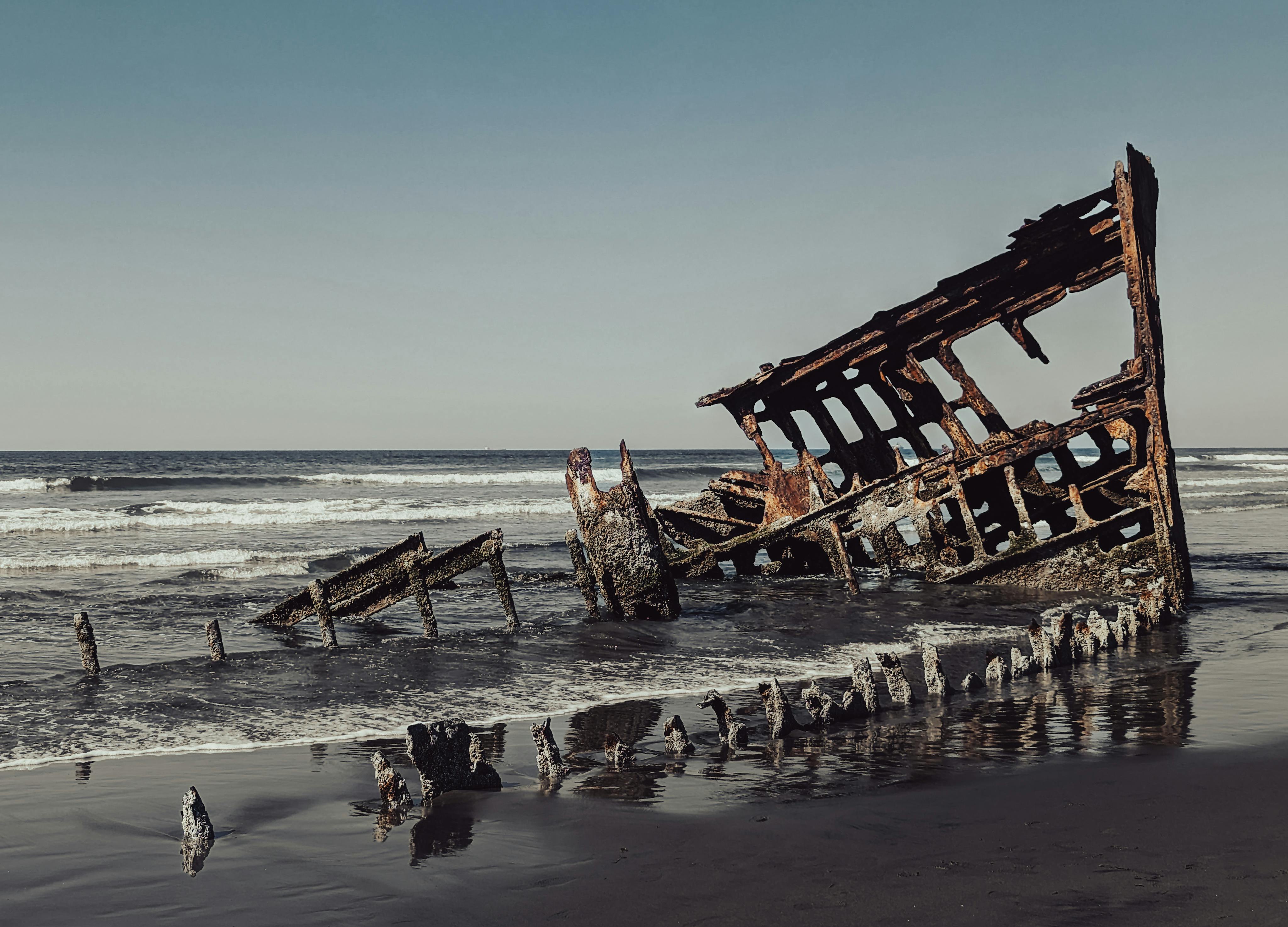 Rustic Shipwreck at Oregon Coast Beach · Free Stock Photo