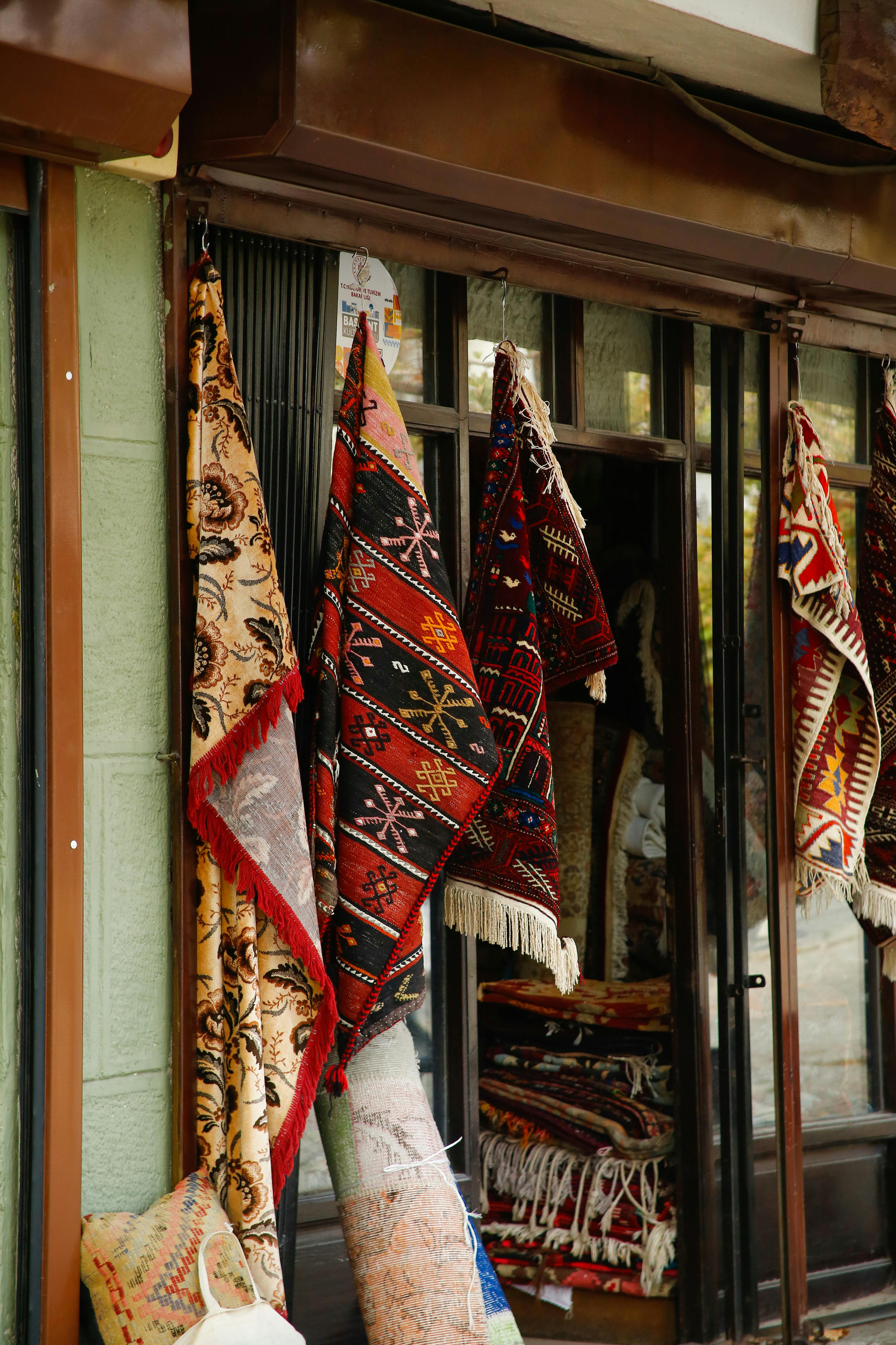 Traditional Handmade Rugs Displayed Outdoors · Free Stock Photo
