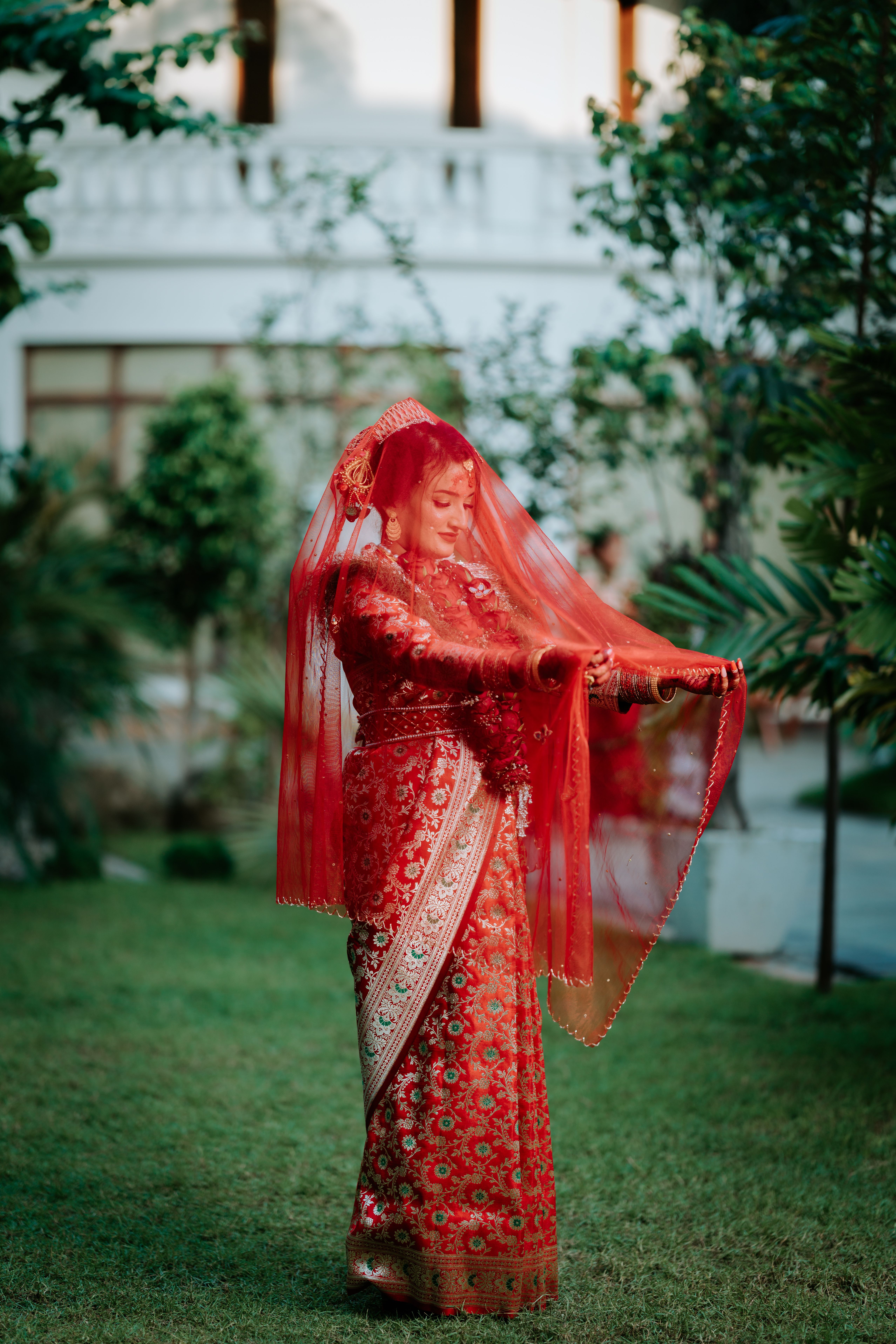 Elegant Bride in Traditional Red Attire Outdoors · Free Stock Photo