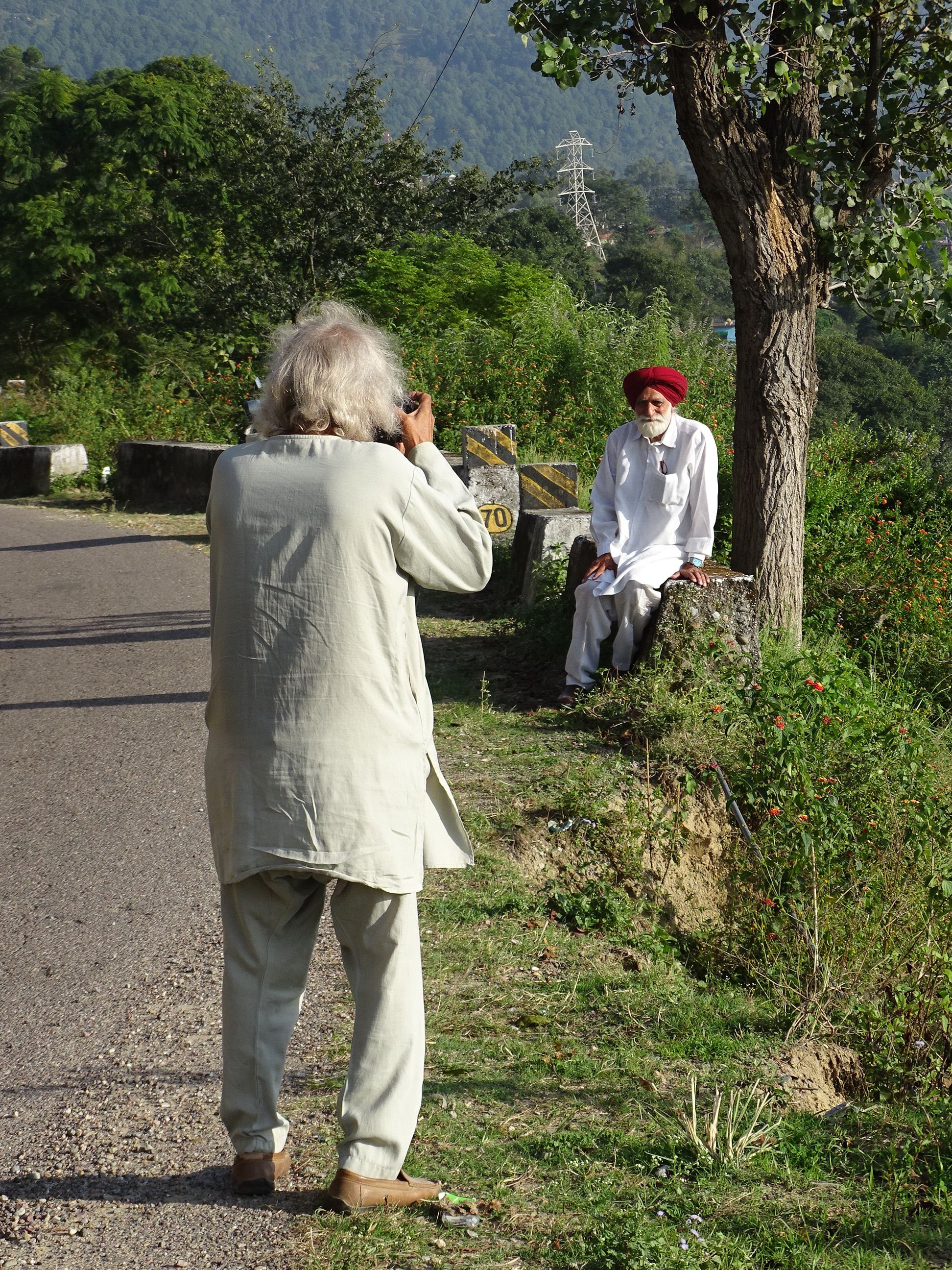 Elderly Photographer Capturing Scenic Portrait Outdoors · Free Stock Photo