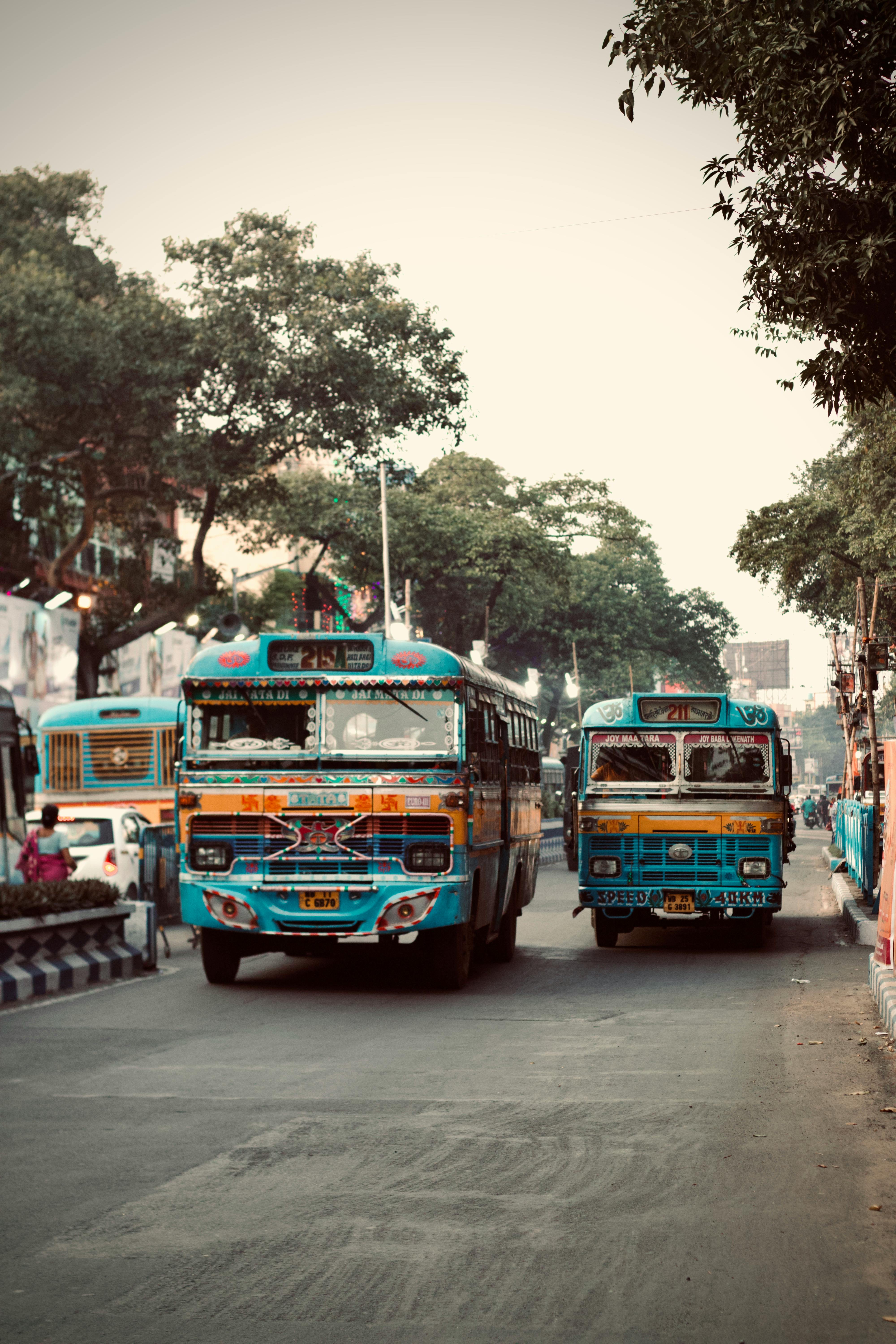 Colorful Indian Buses on Urban Street · Free Stock Photo