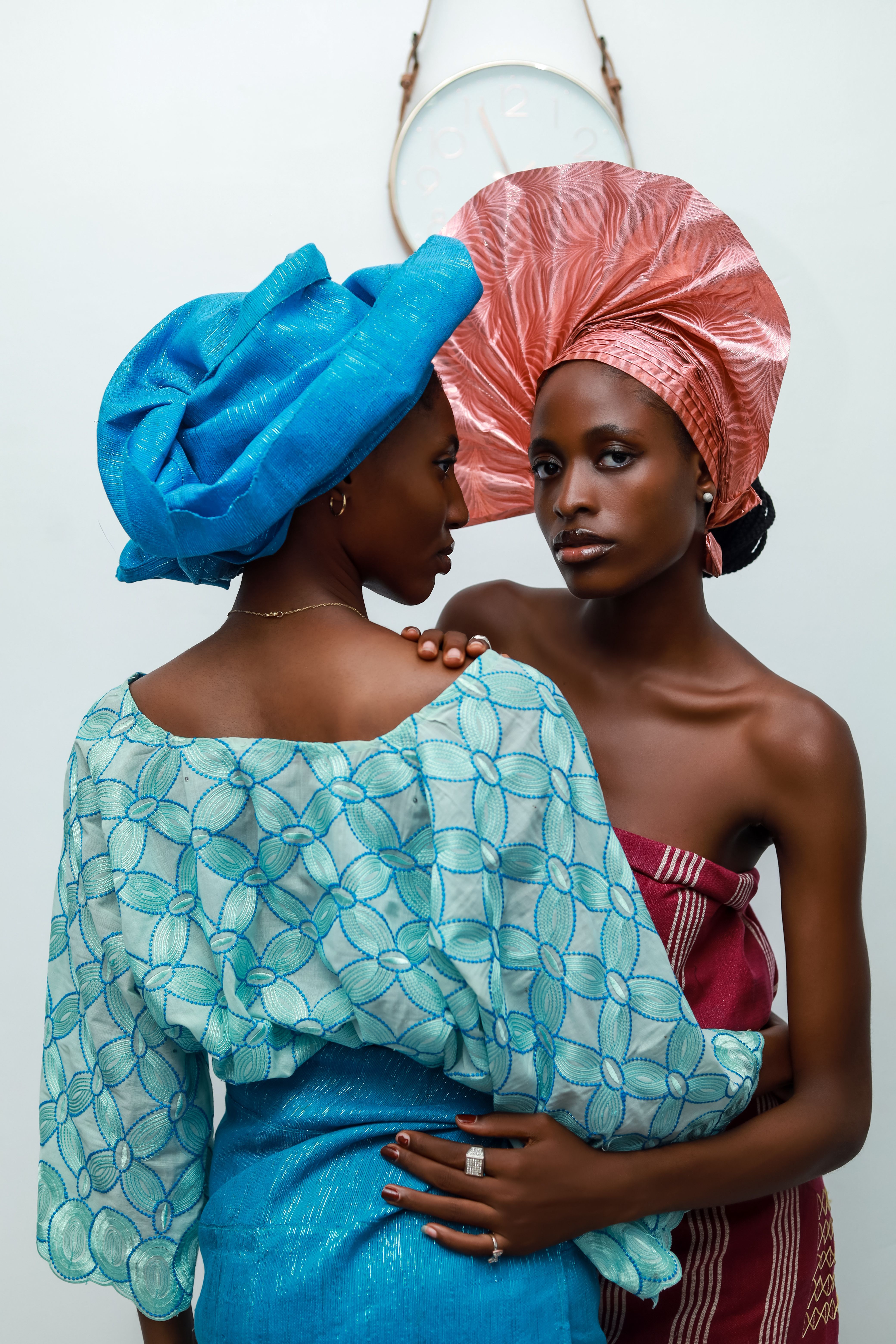 Elegant Portrait of Two Women in Traditional Headwraps · Free Stock Photo