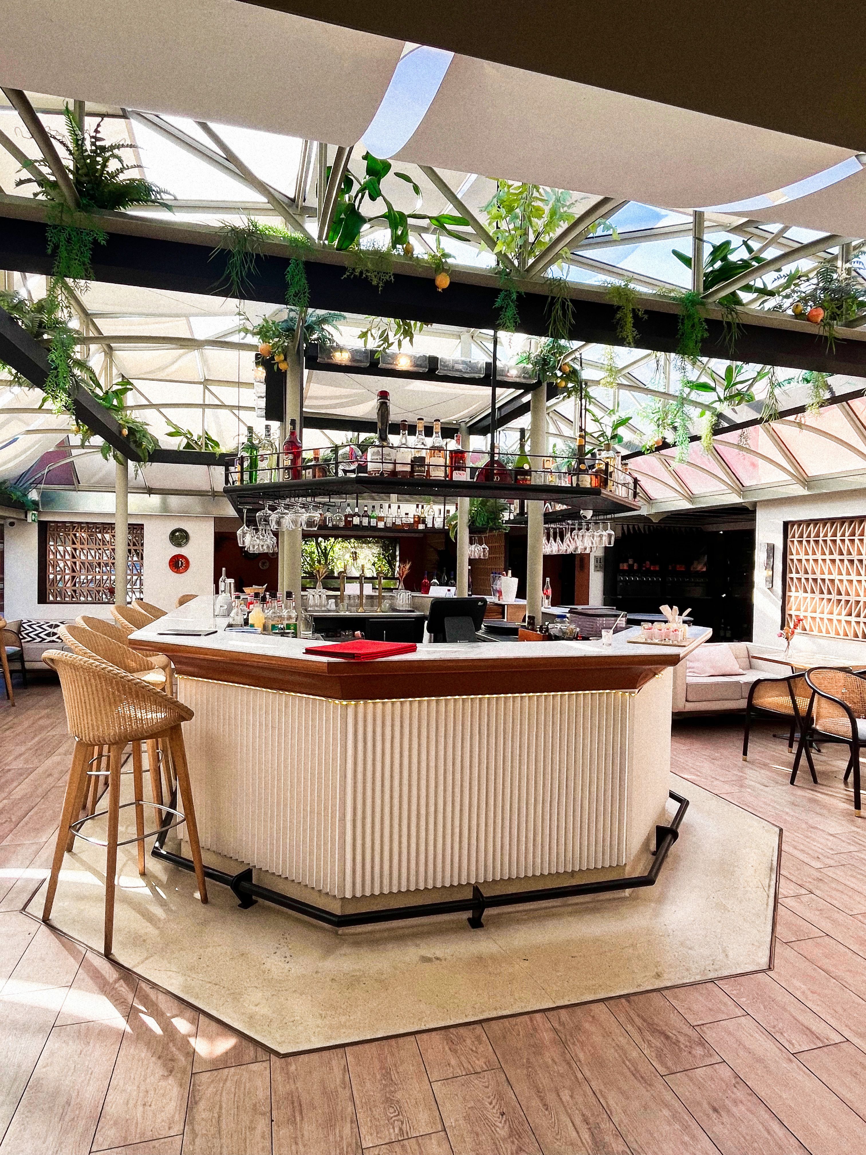 Elegant Indoor Bar with Skylight Roof and Modern Decor · Free Stock Photo