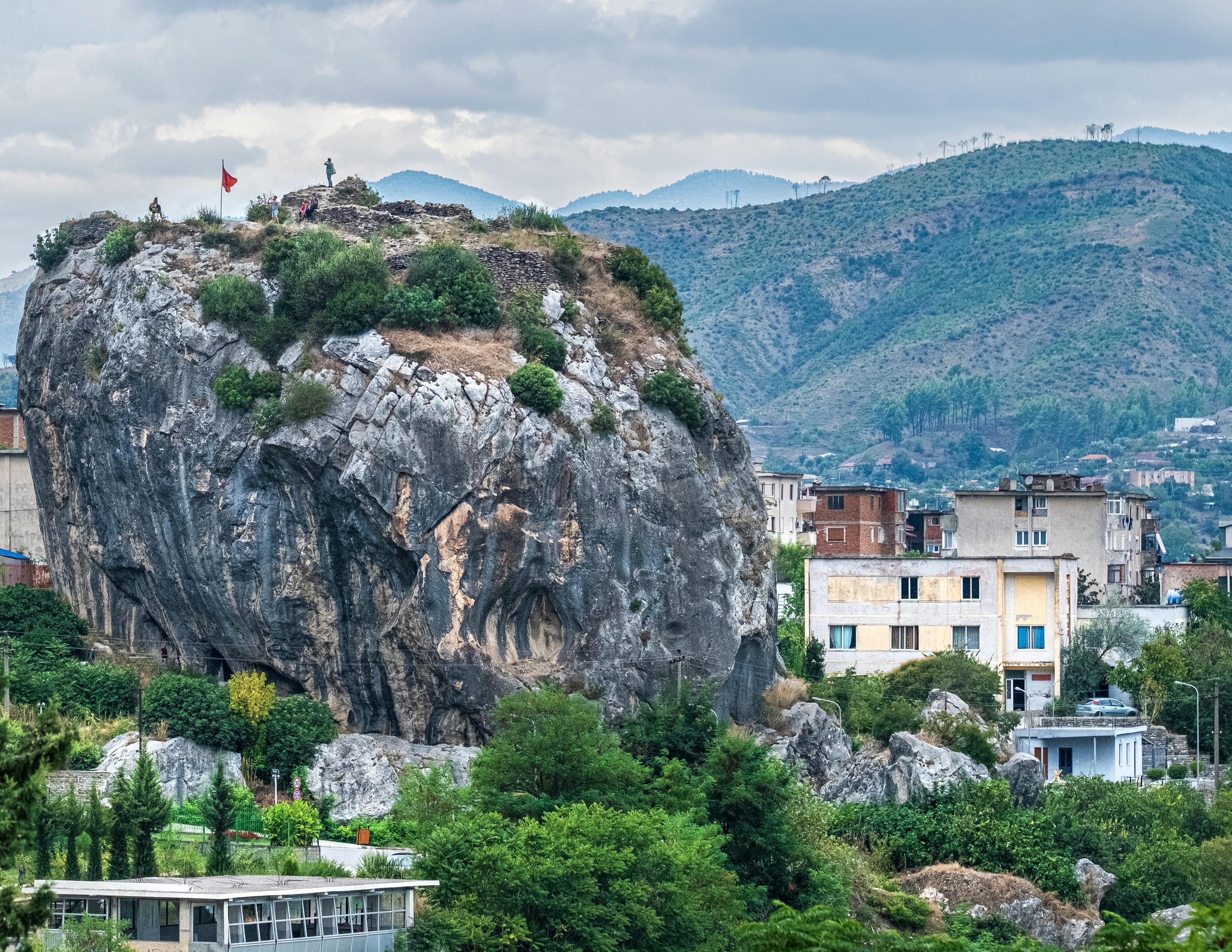 Majestic Rock Formation with Albanian Cityscape · Free Stock Photo