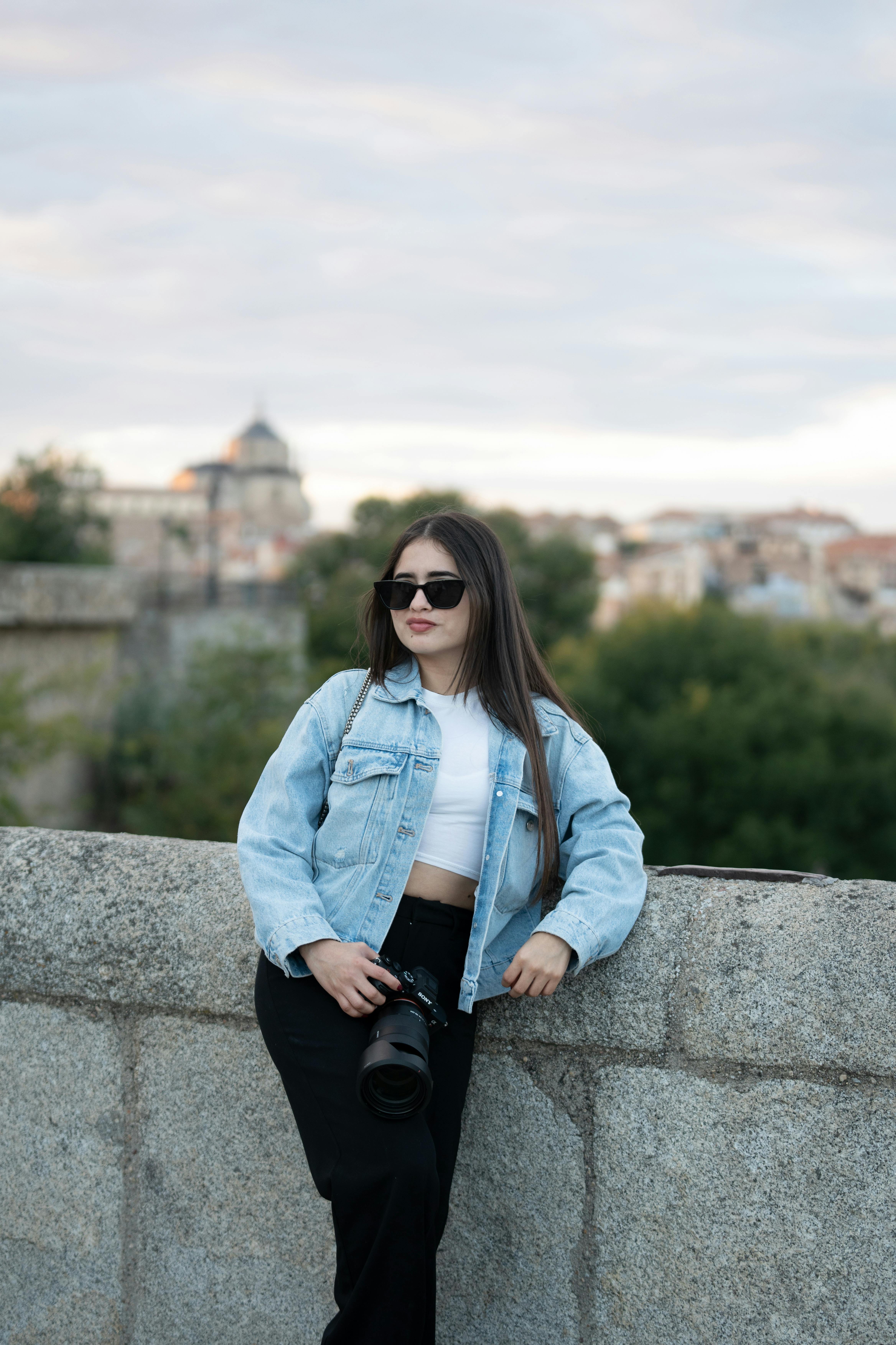 Confident Photographer Posing Outdoors · Free Stock Photo