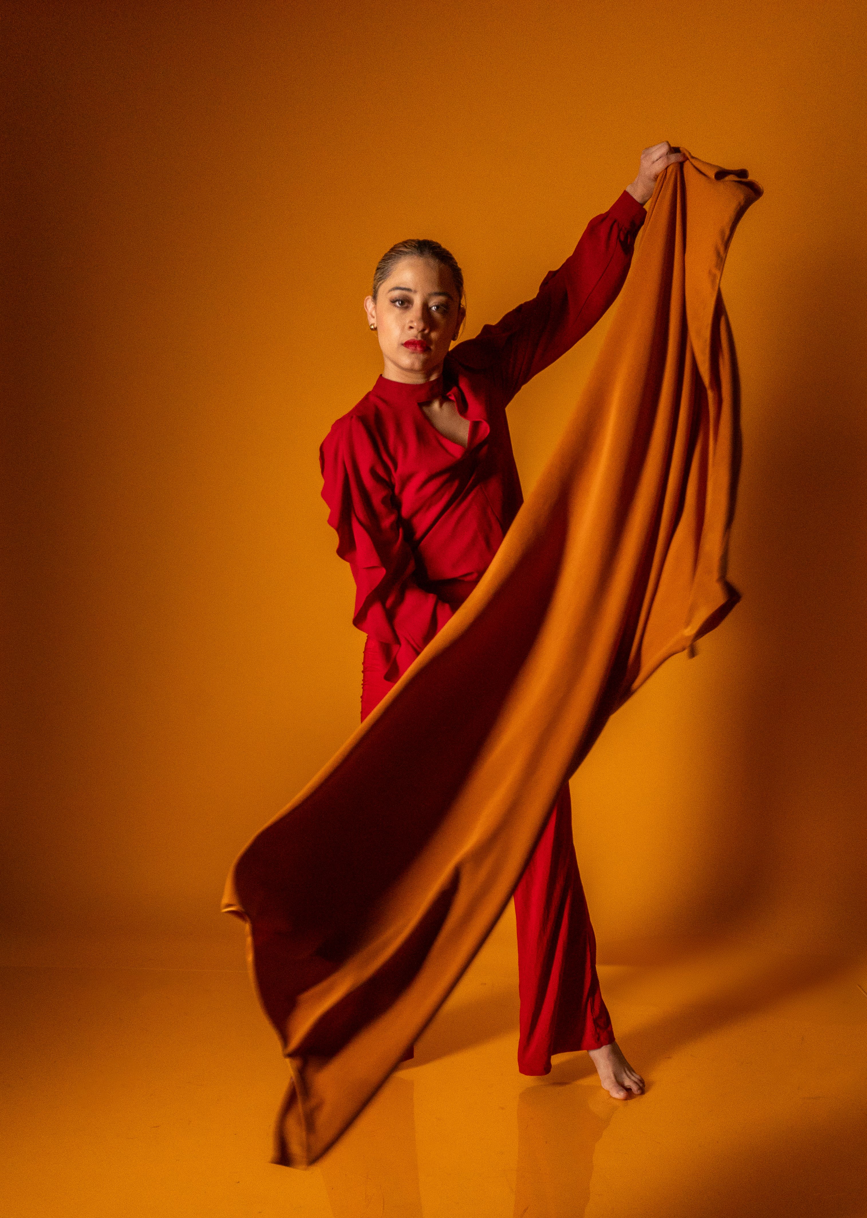Elegant Dancer in Red and Orange Studio Portrait · Free Stock Photo