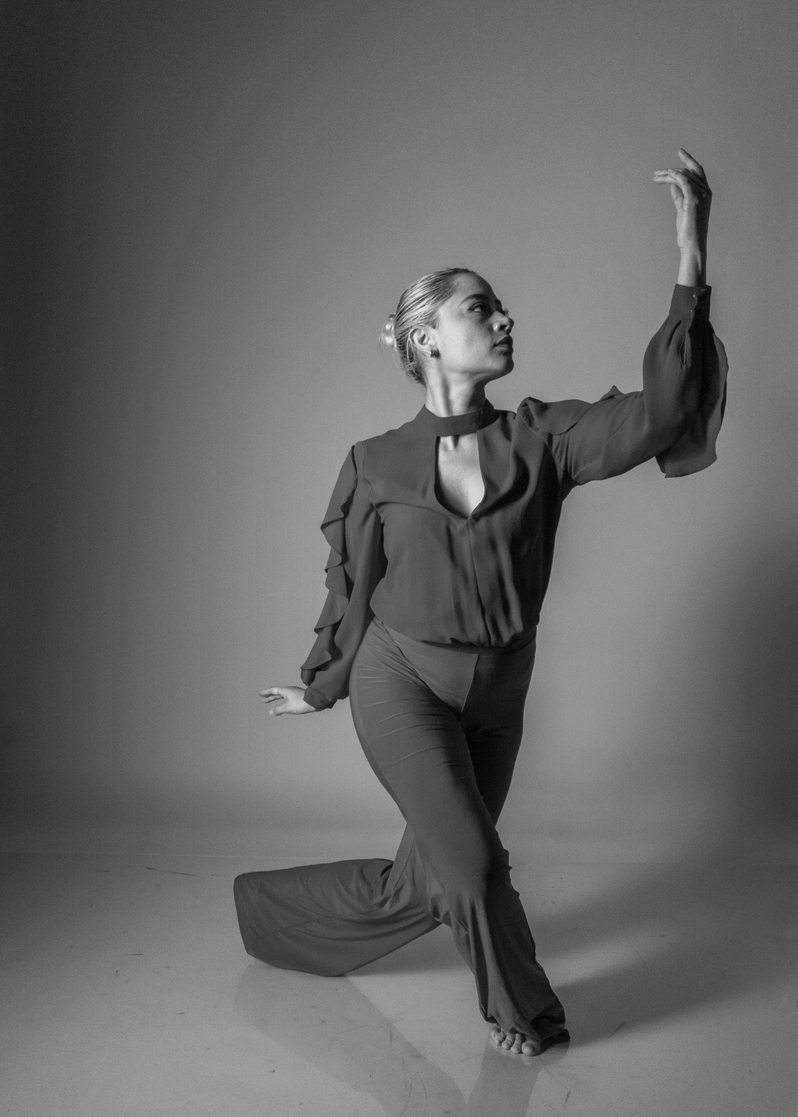 Elegant Female Dancer in Monochrome Studio Setting · Free Stock Photo