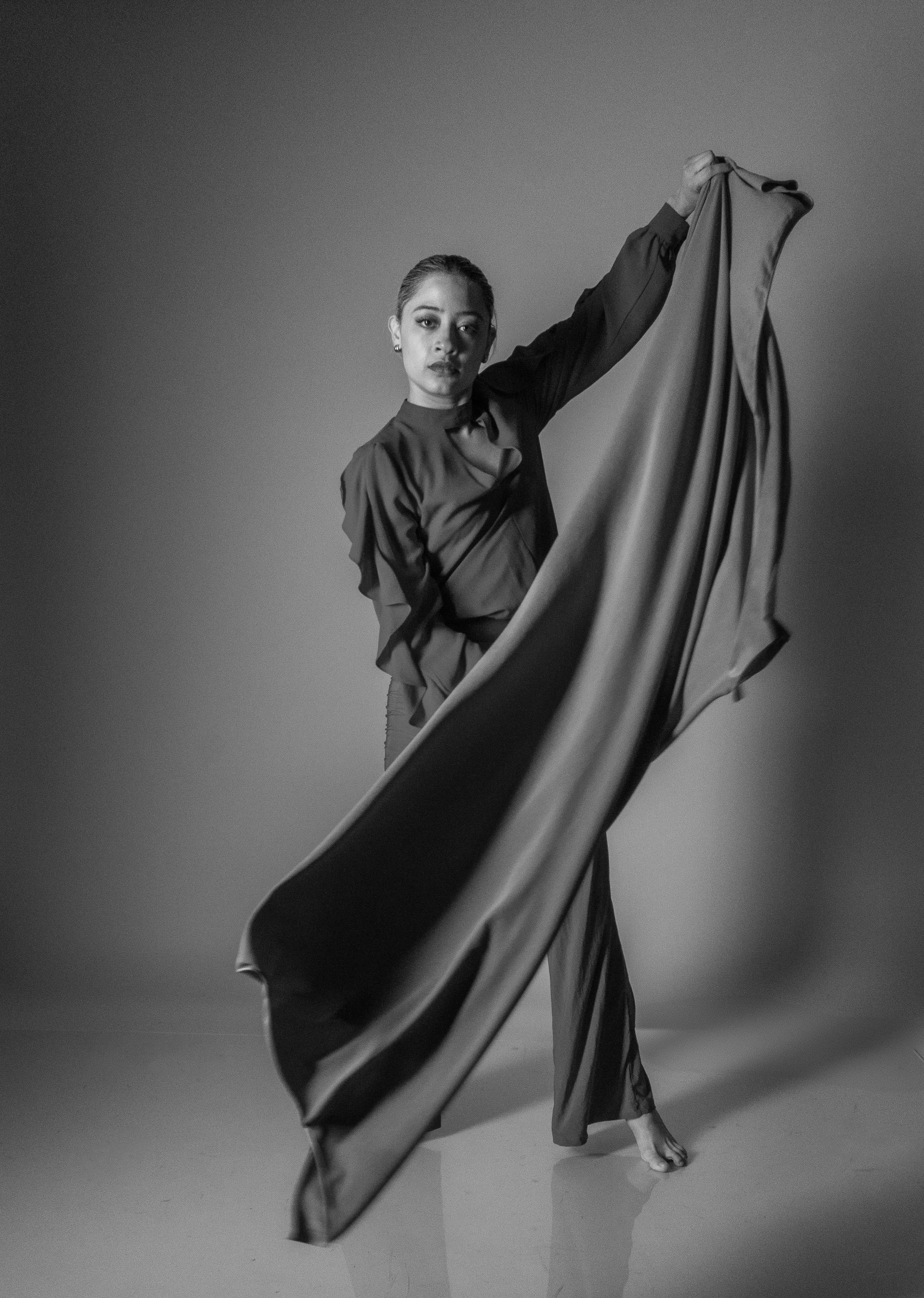 Elegant Female Dancer in Flowing Fabric Showpiece · Free Stock Photo