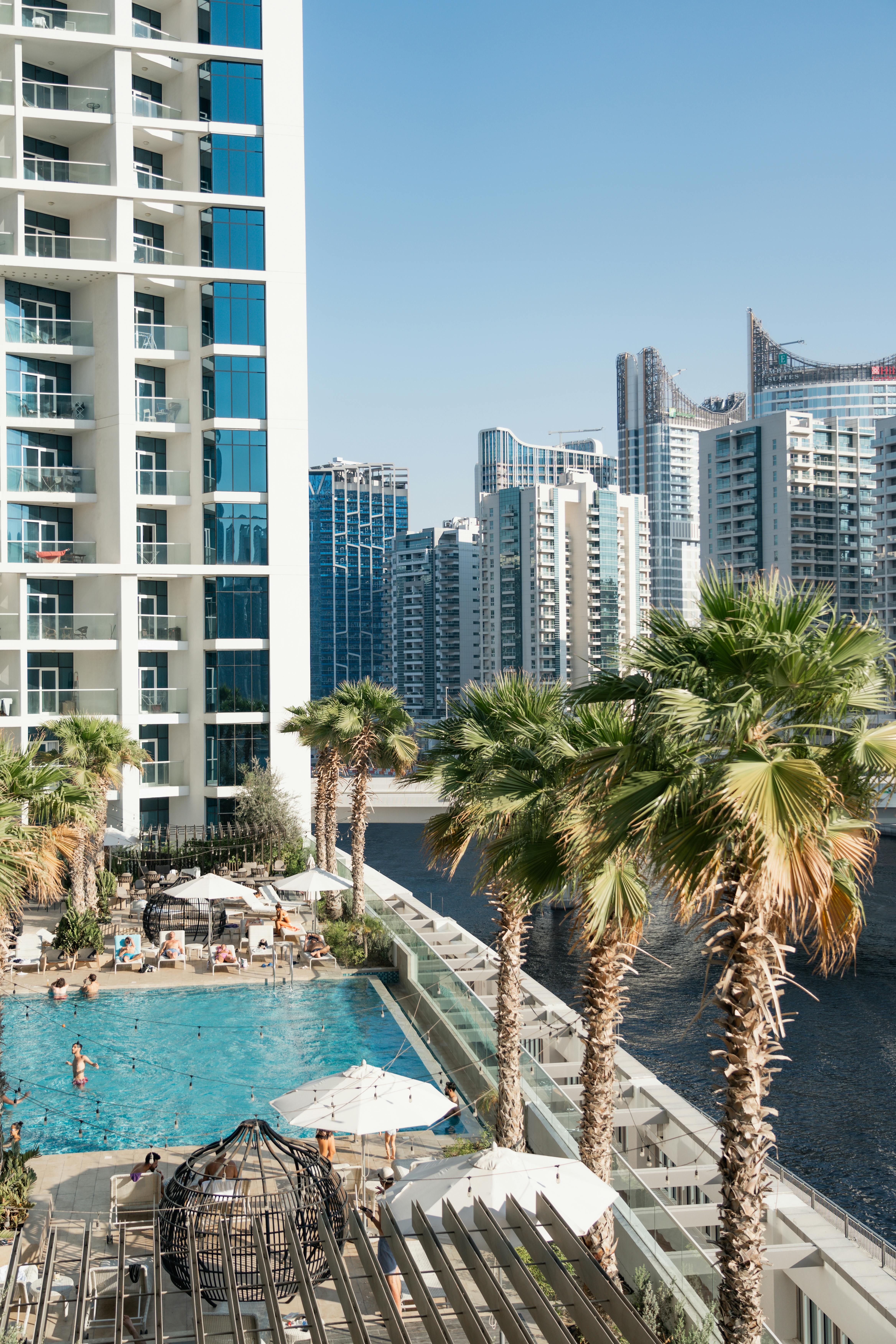 Luxury Poolside View with Dubai Skyline · Free Stock Photo