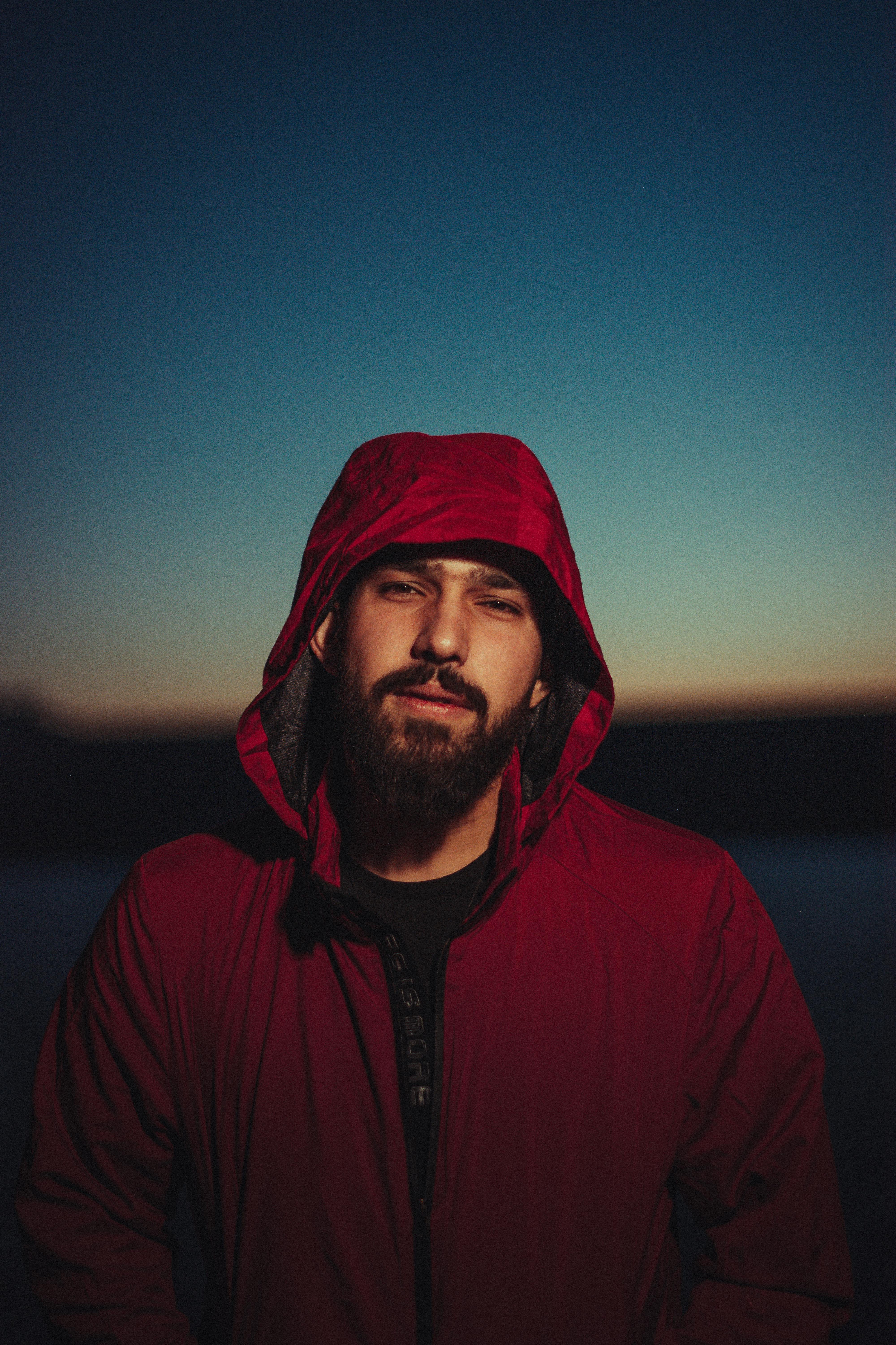Portrait of Man in Red Jacket at Twilight · Free Stock Photo