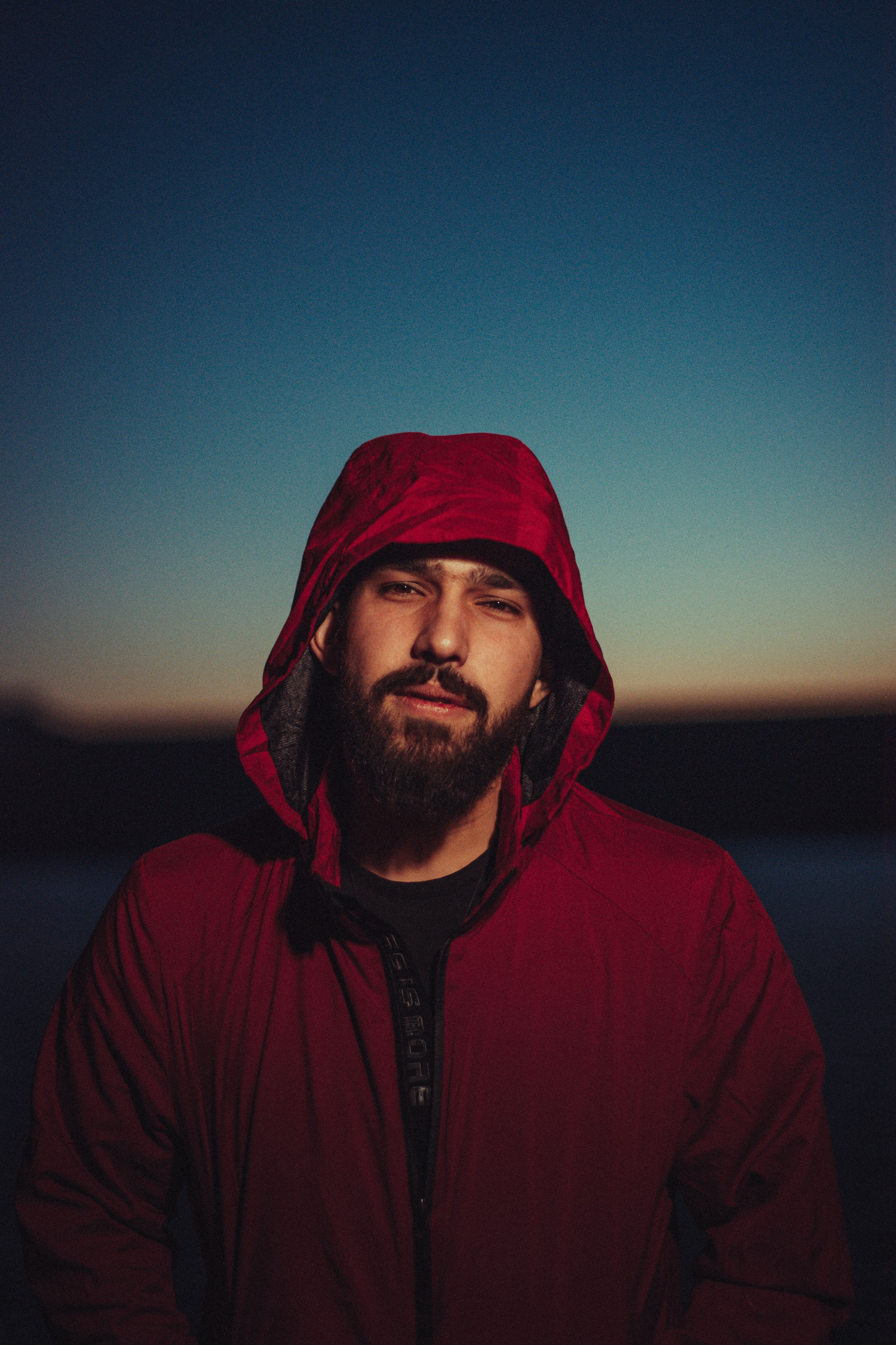 Portrait of Man in Red Jacket at Twilight · Free Stock Photo