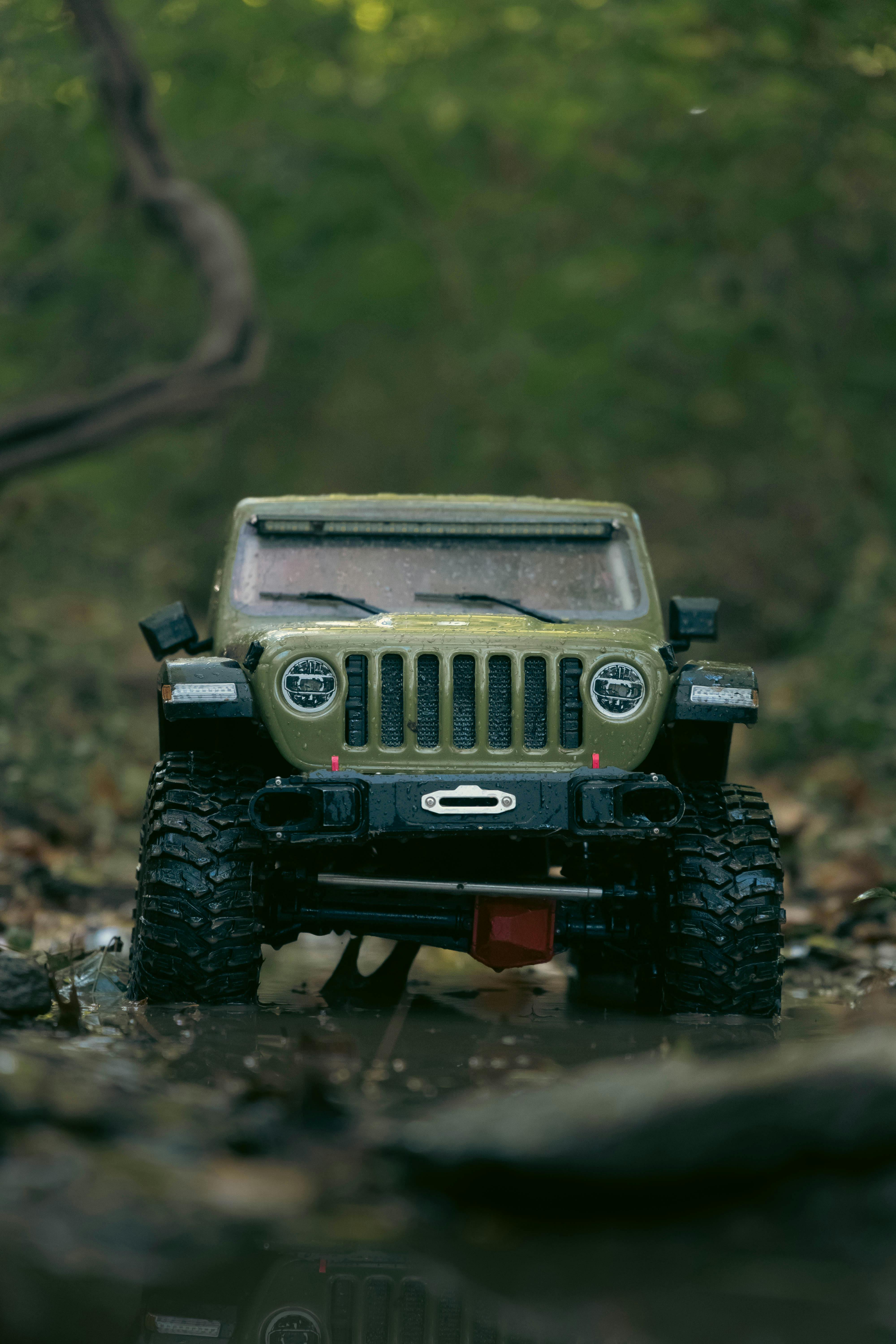 Toy Off-Road Vehicle in Forest Setting · Free Stock Photo