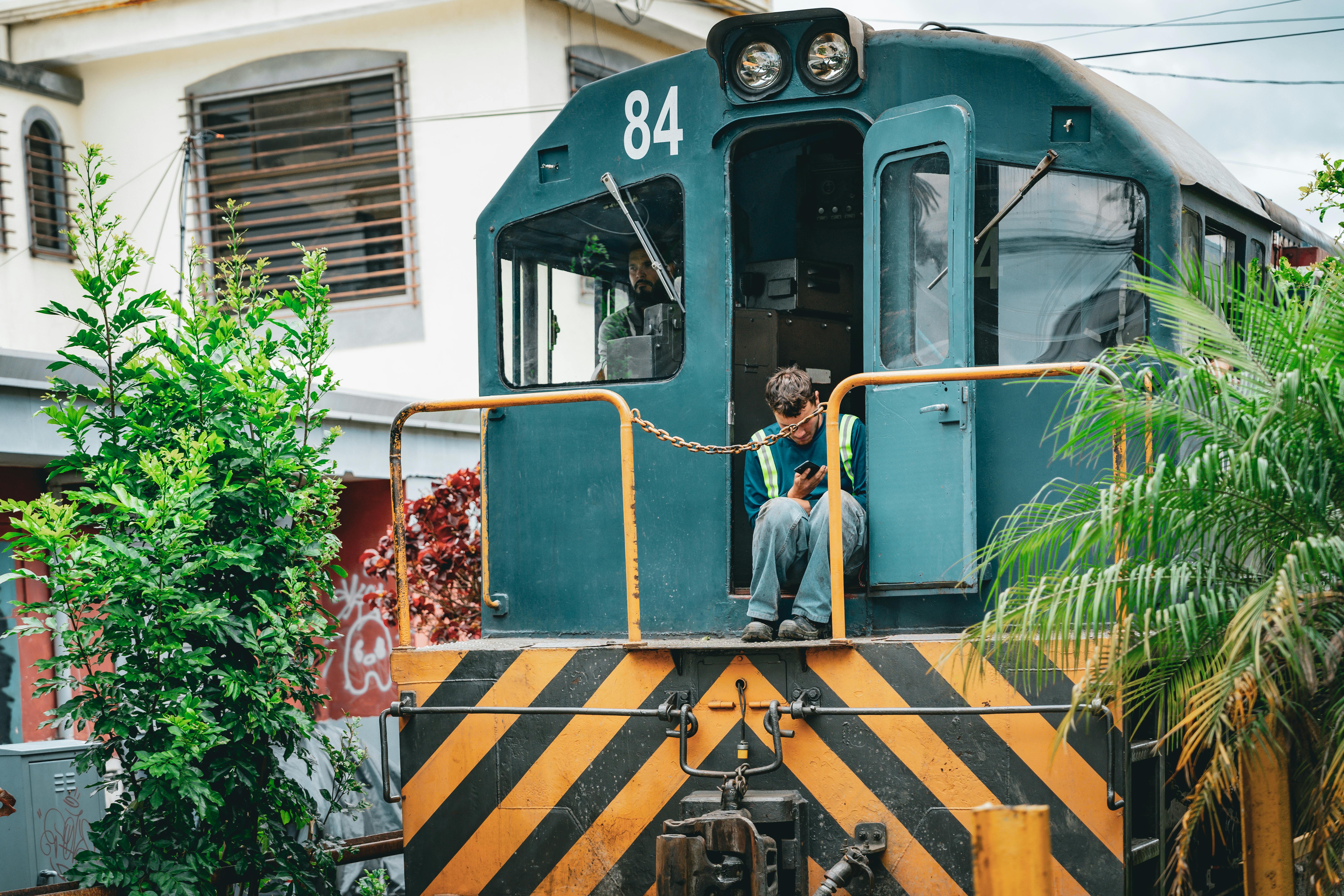 Man Sitting on Train in San José, Costa Rica · Free Stock Photo