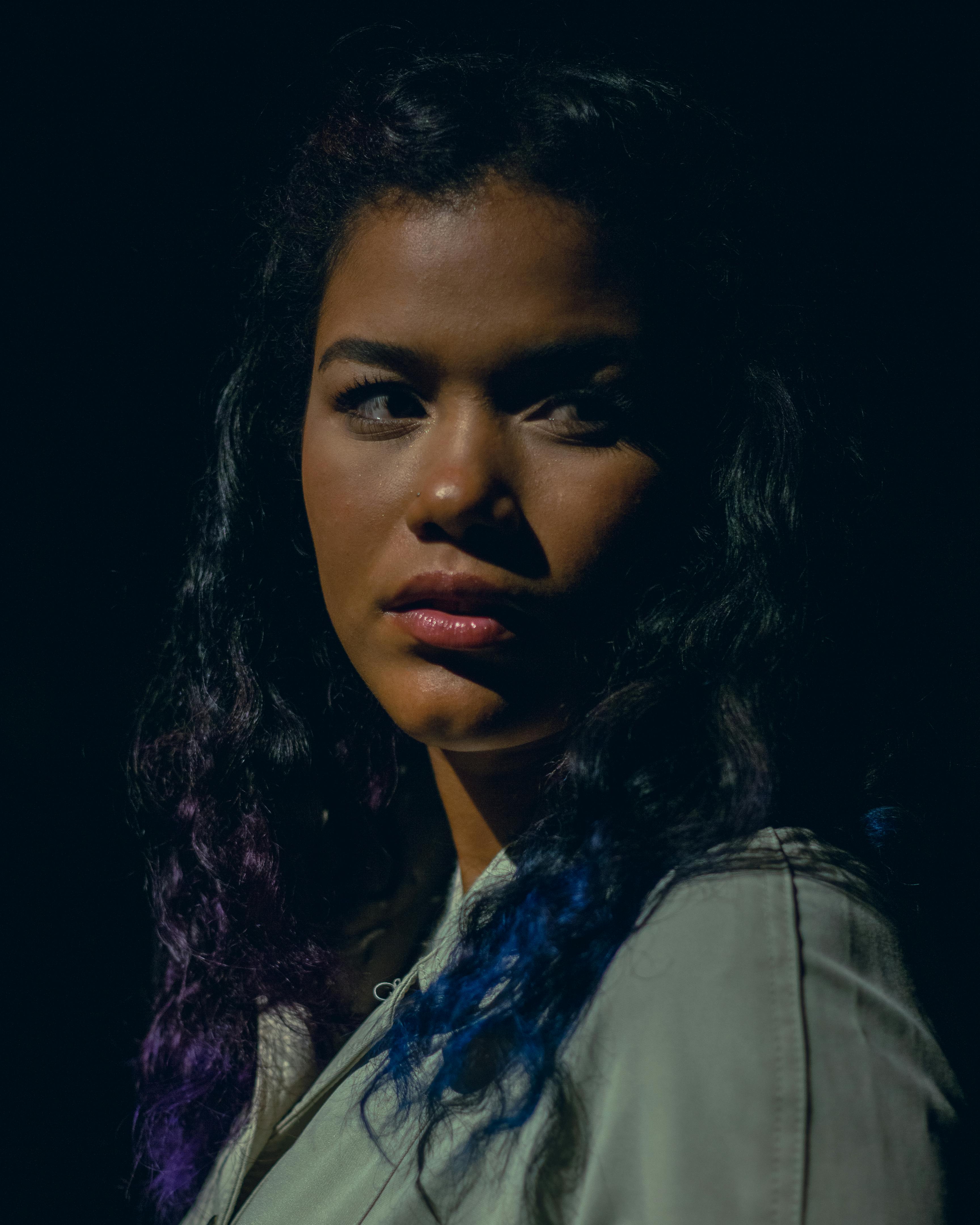 Dramatic Portrait of a Young Woman in Low Light · Free Stock Photo