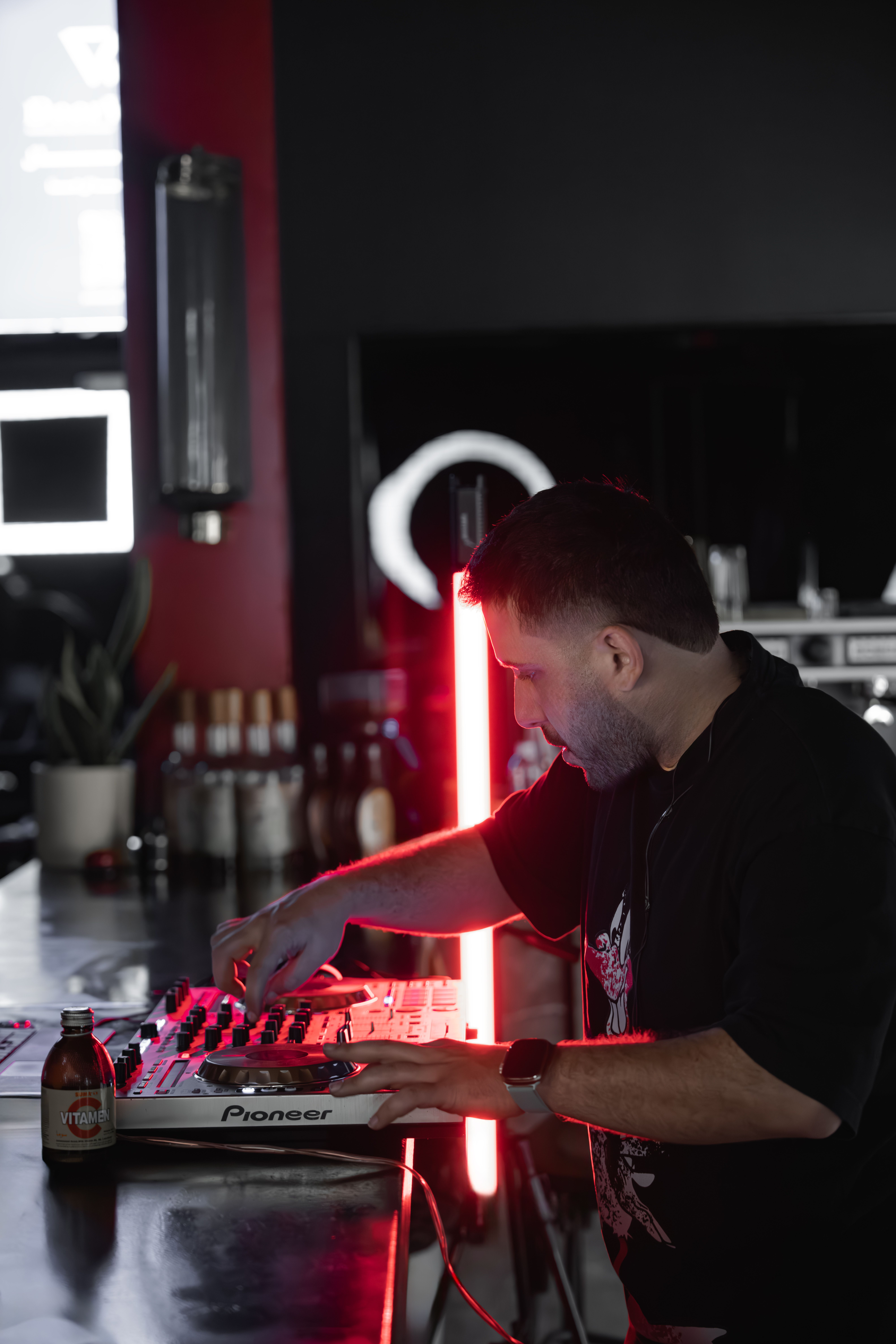 DJ Mixing Music in Modern Club Setting · Free Stock Photo