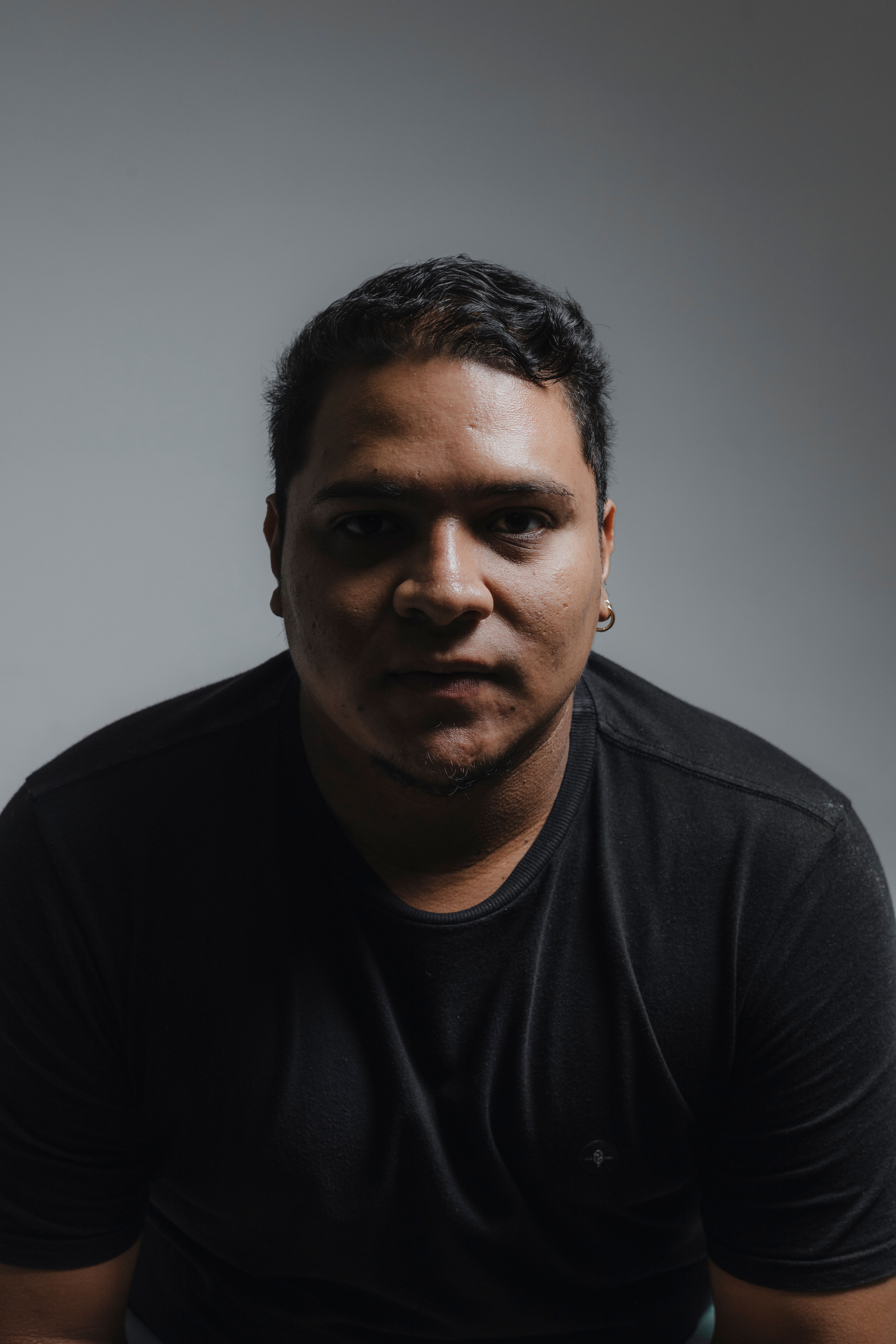 Portrait of Man in Studio with Dramatic Lighting · Free Stock Photo