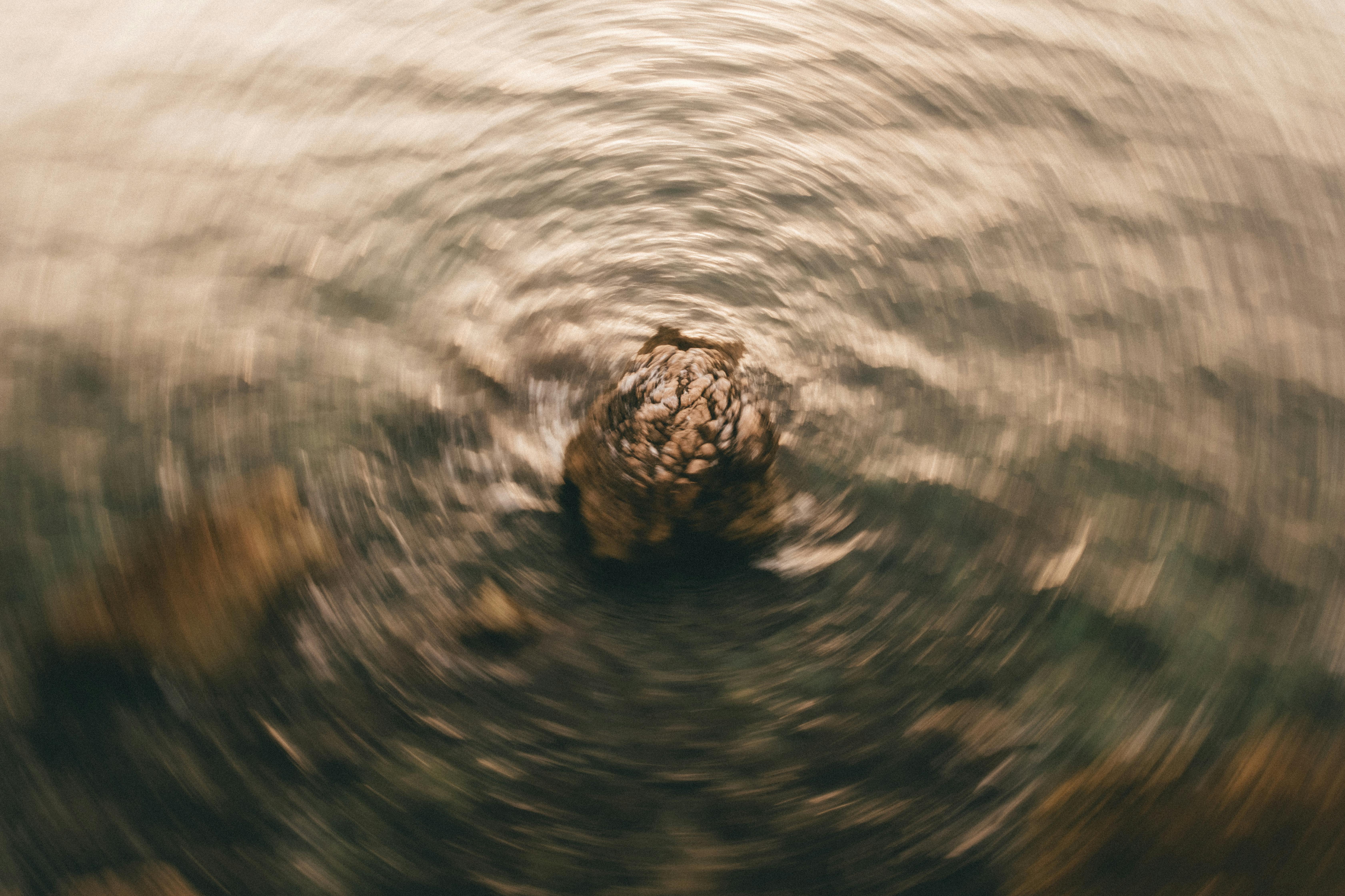 Hypnotic Swirl of a Rock in Marseille Waters · Free Stock Photo