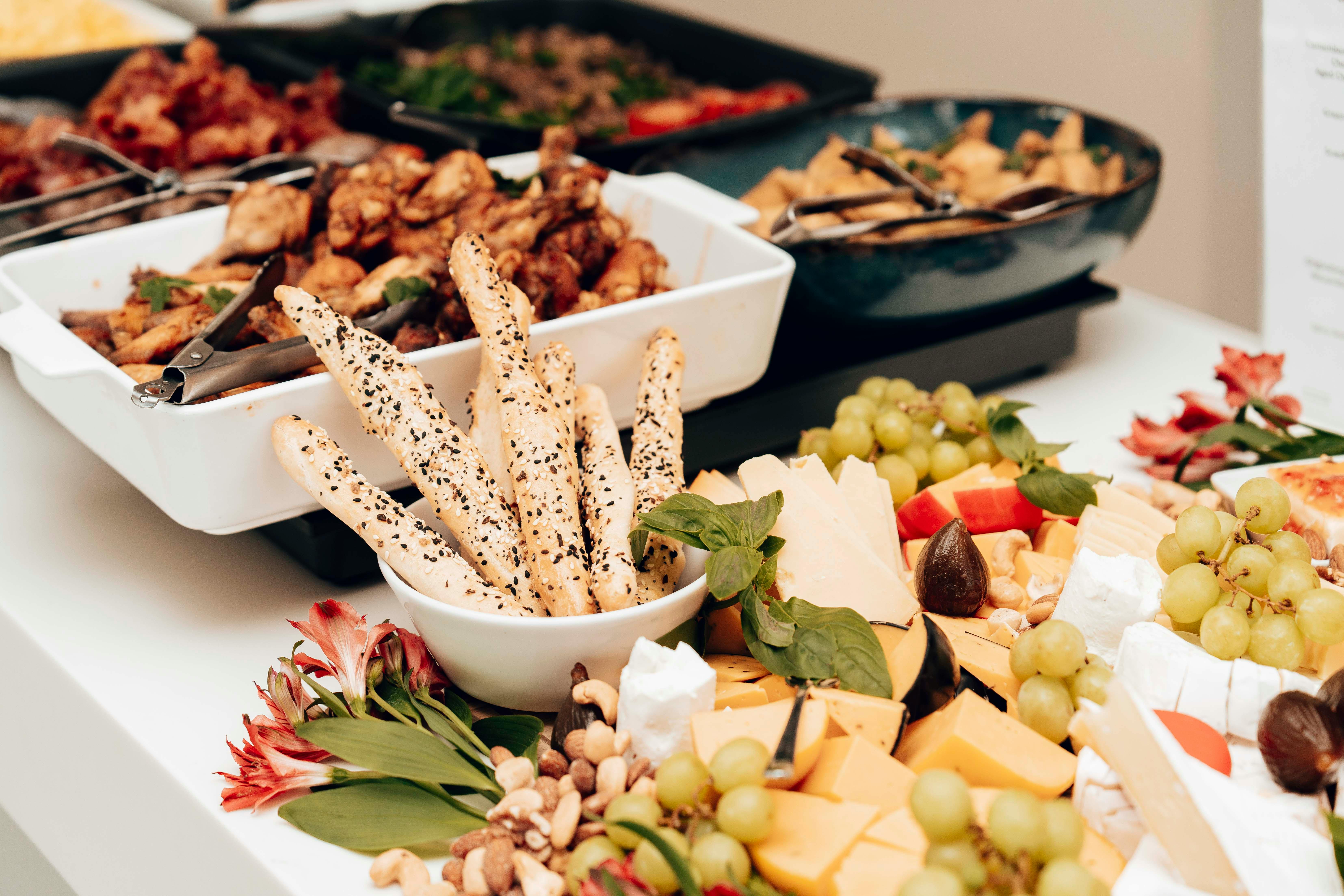 Delicious Assorted Buffet with Cheeses and Snacks · Free Stock Photo