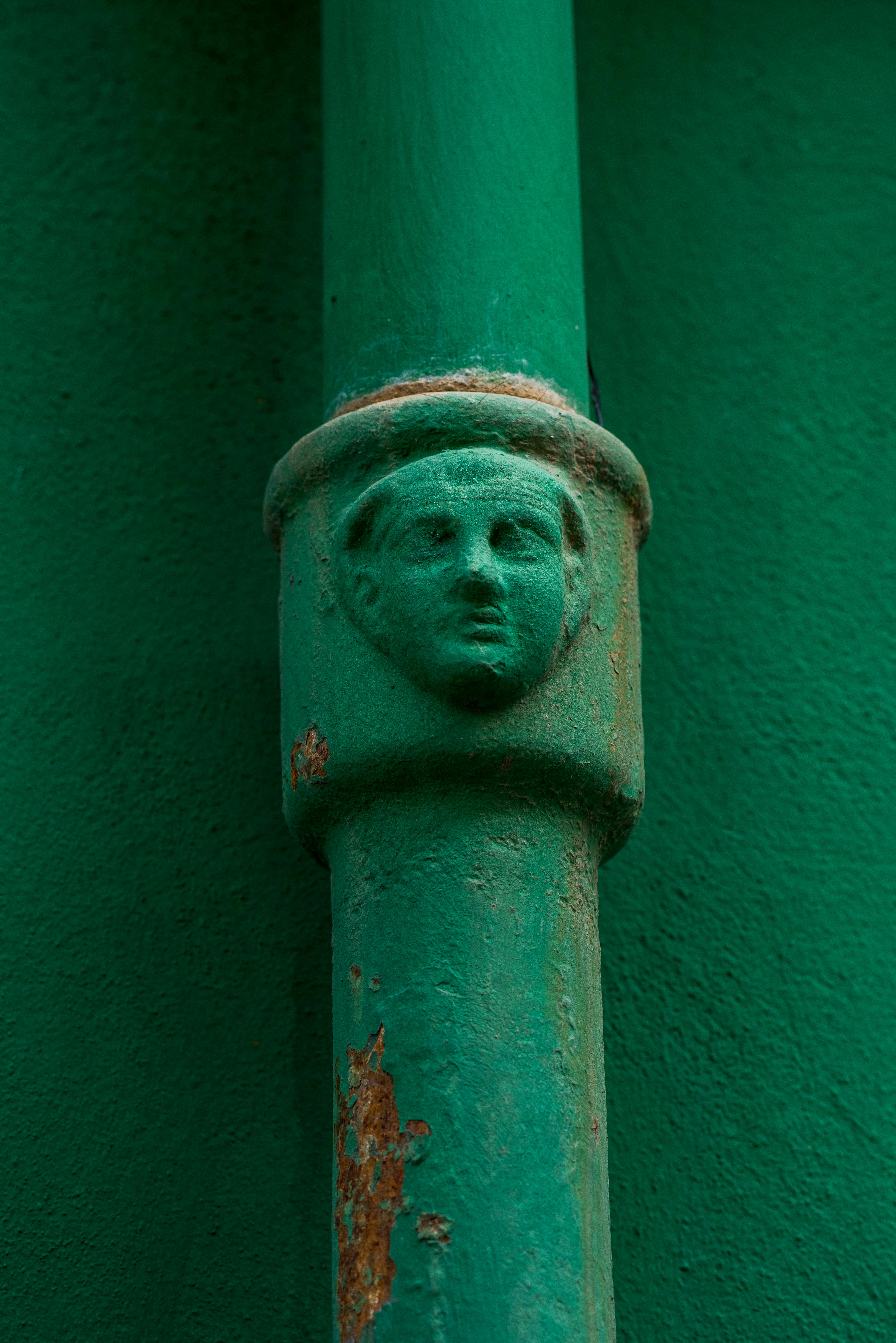 Antique Green Pipe with Face Carving · Free Stock Photo
