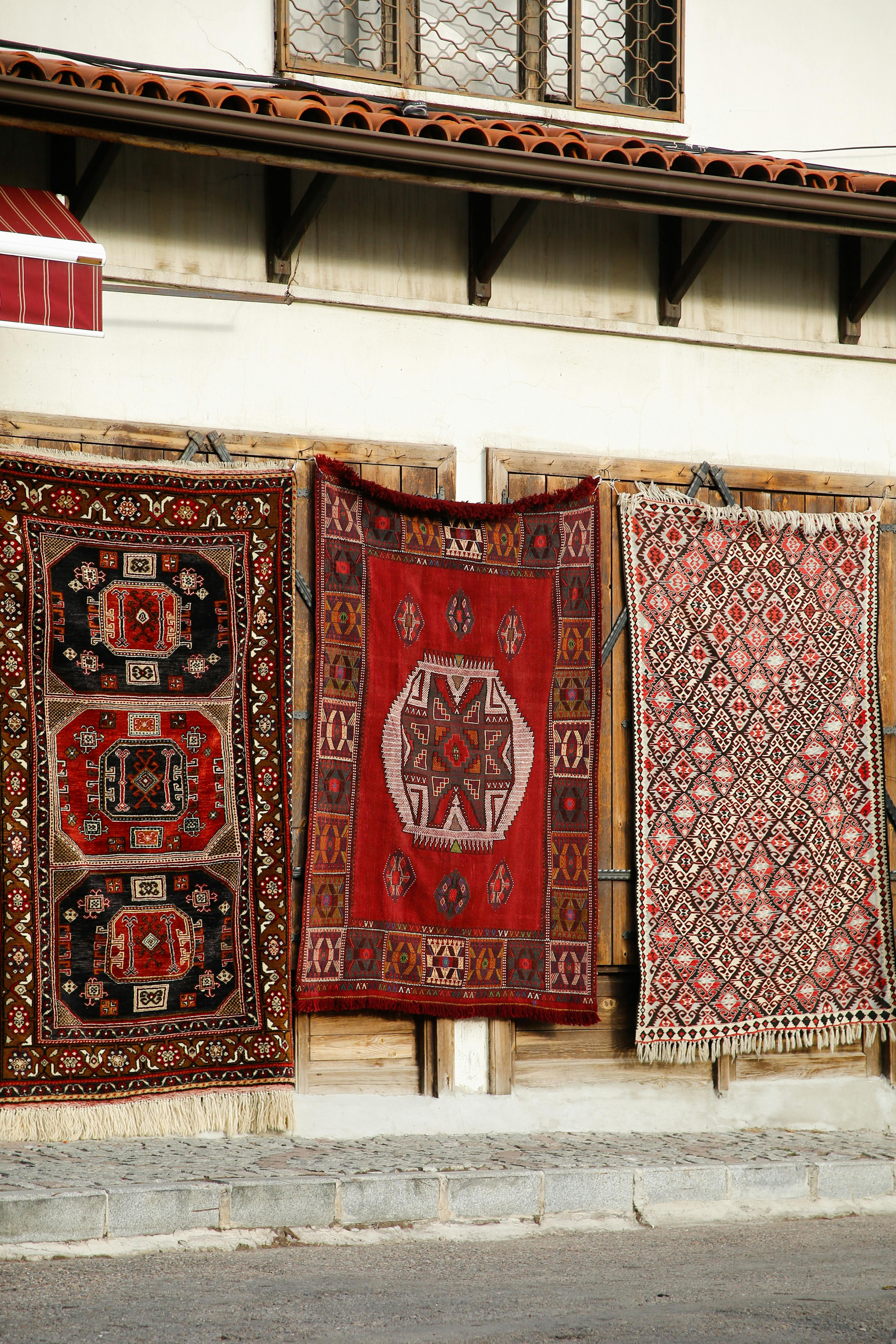 Traditional Oriental Carpets Hanging Outdoors · Free Stock Photo