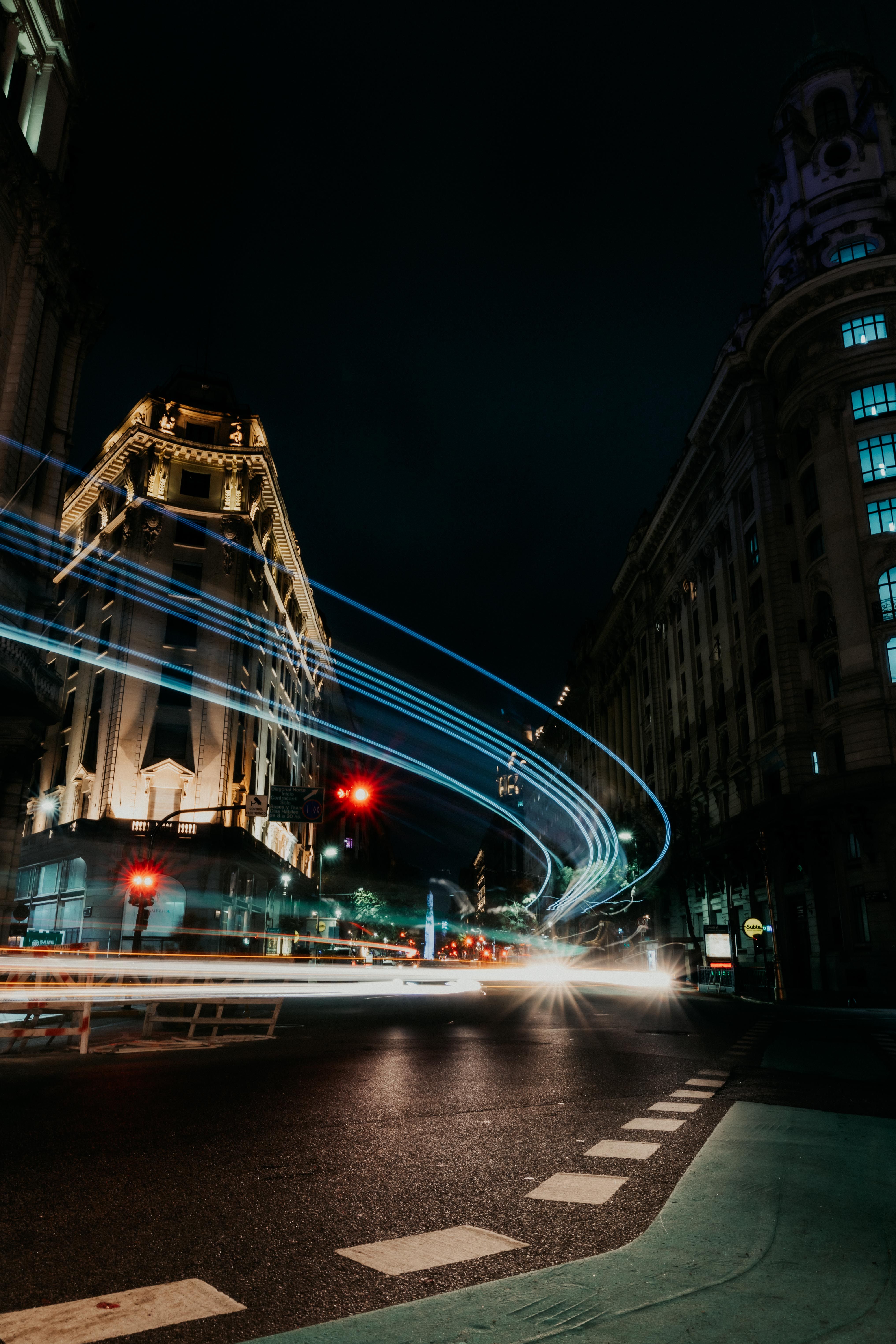 Night Cityscape with Winding Light Trails · Free Stock Photo