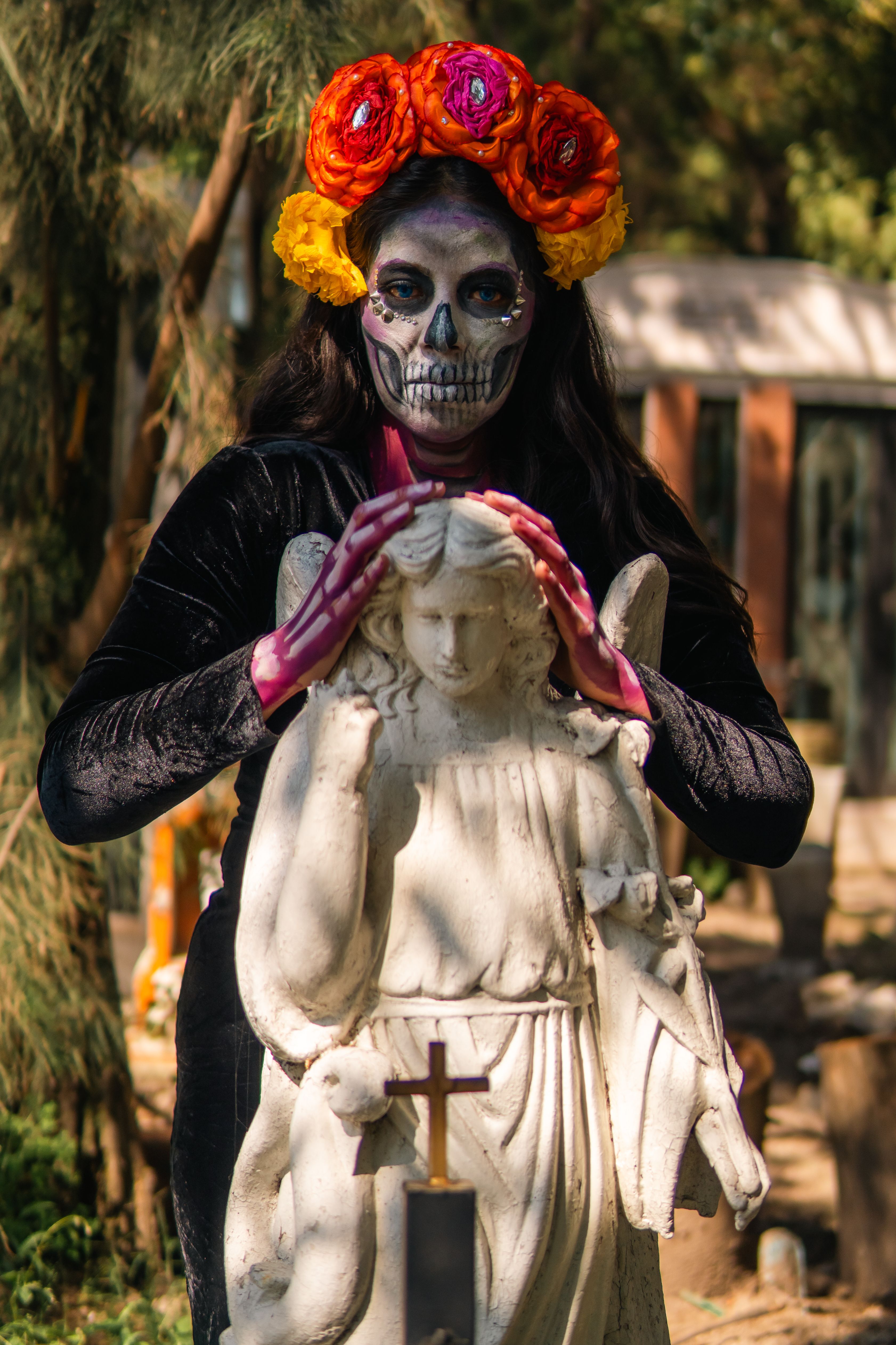 Traditional Mexican Catrina in a Cemetery Setting · Free Stock Photo