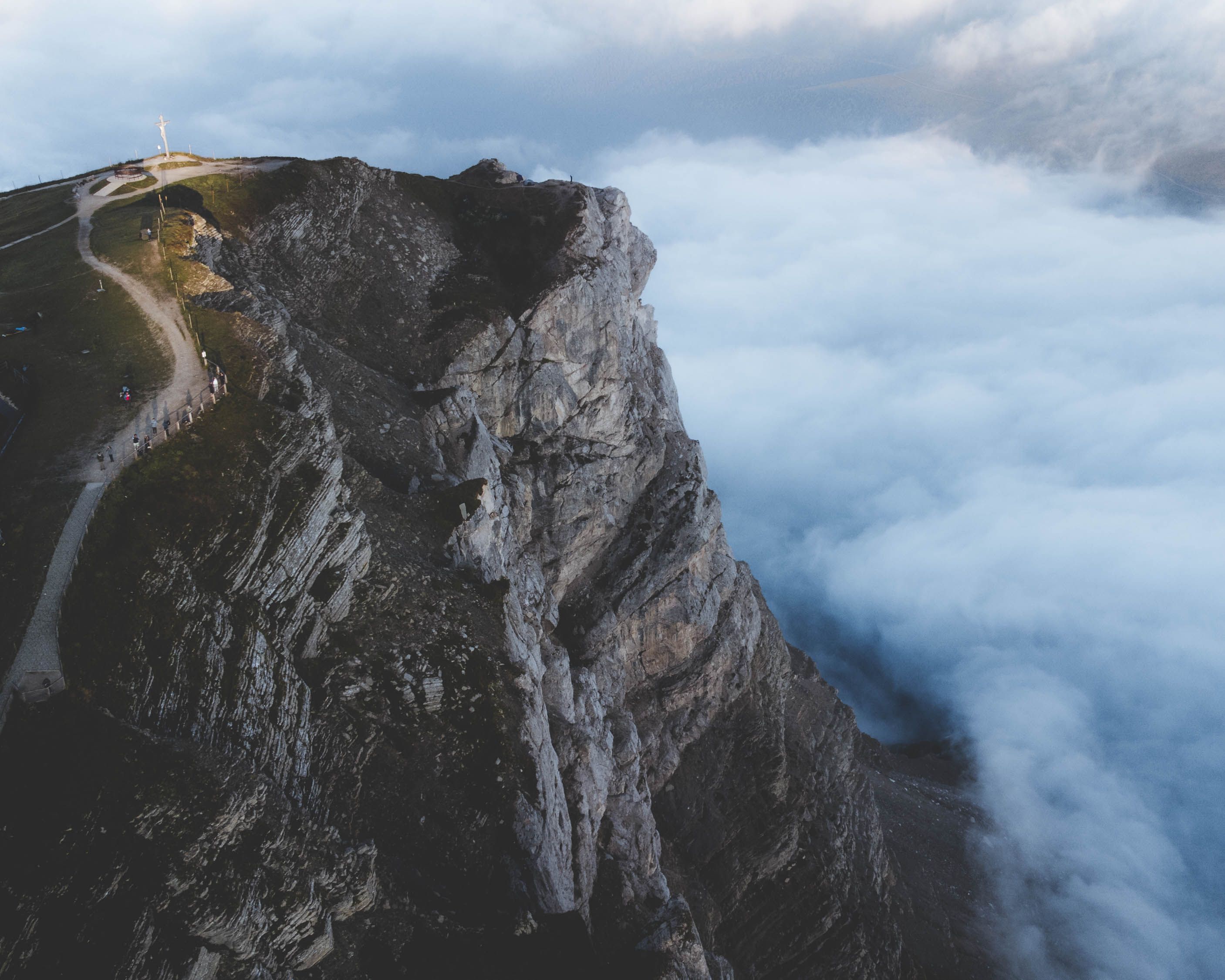 Dramatic Mountain Cliff Above the Clouds · Free Stock Photo