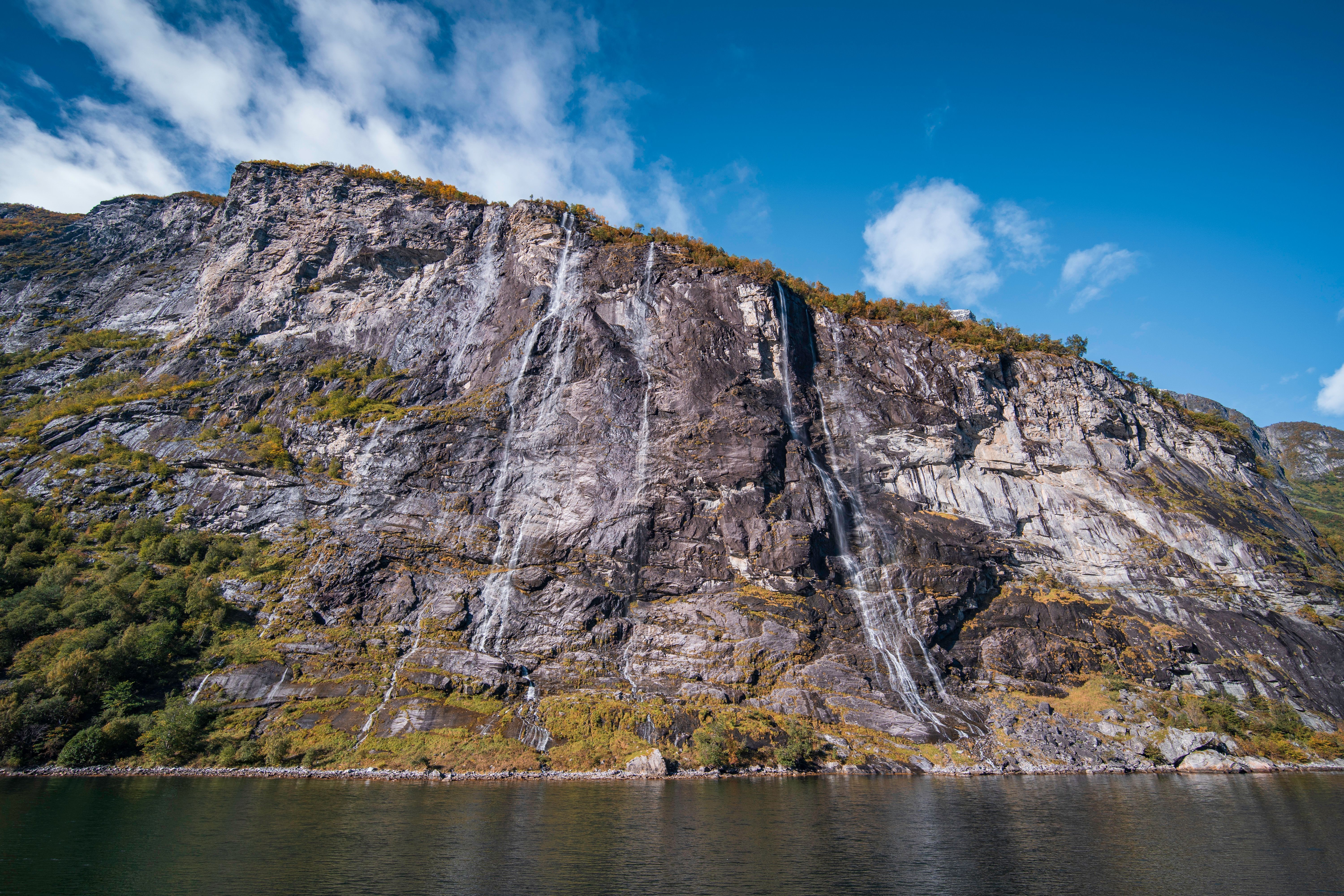Scenic Waterfall in Norwegian Fjord Landscape · Free Stock Photo