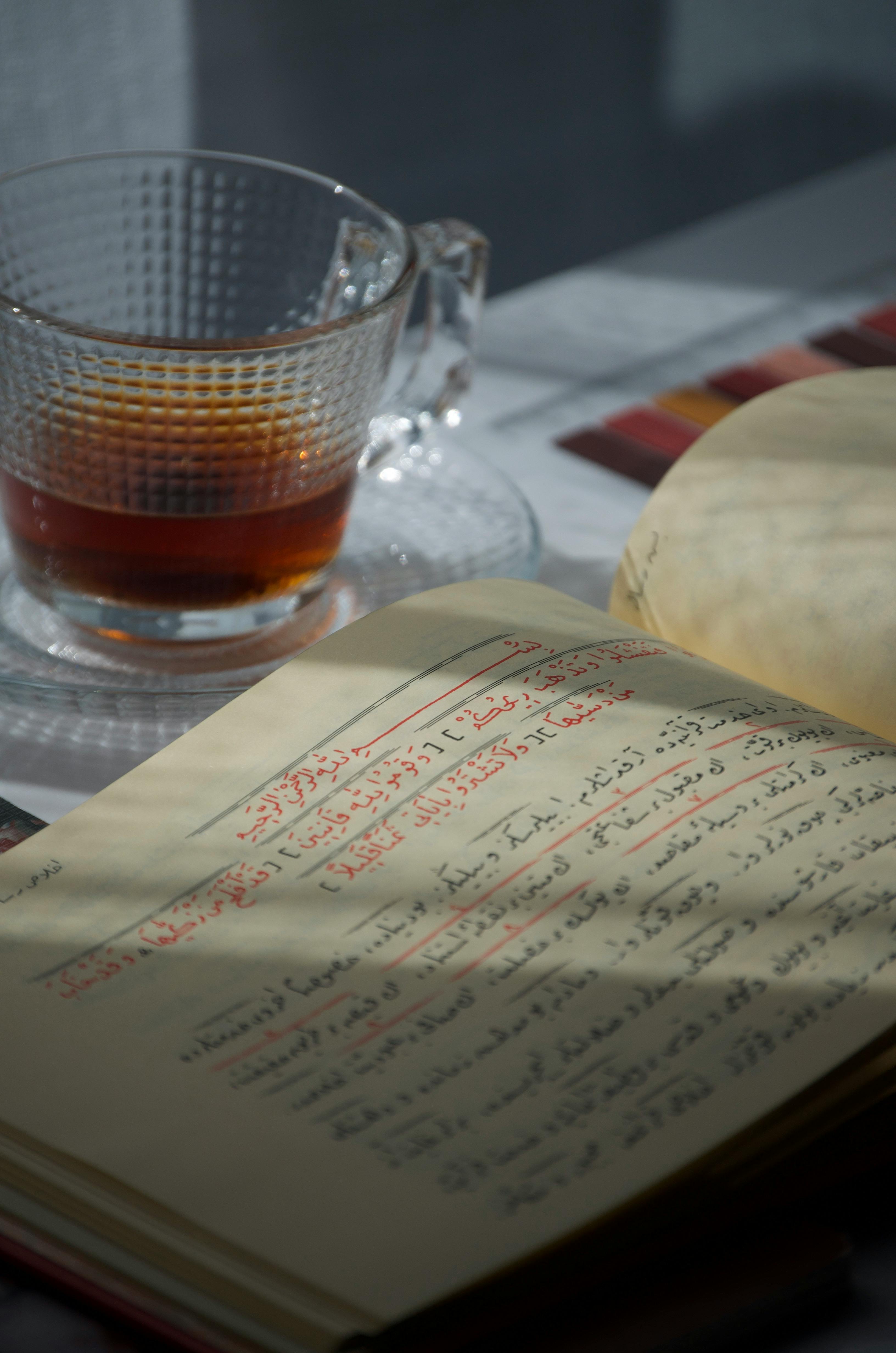 Captivating Still Life of Open Book with Tea · Free Stock Photo