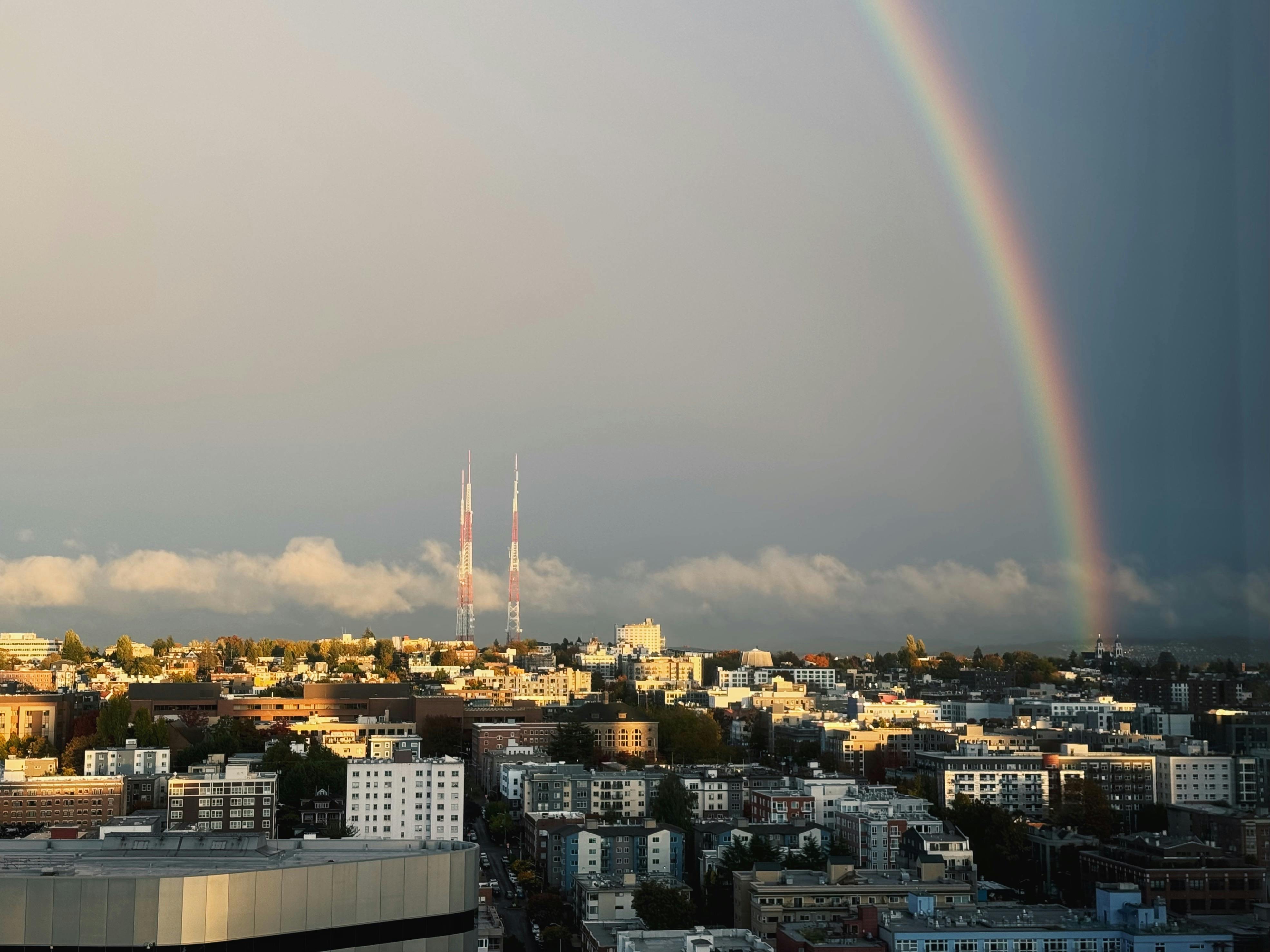 Scenic Urban Rainbow Over Cityscape · Free Stock Photo