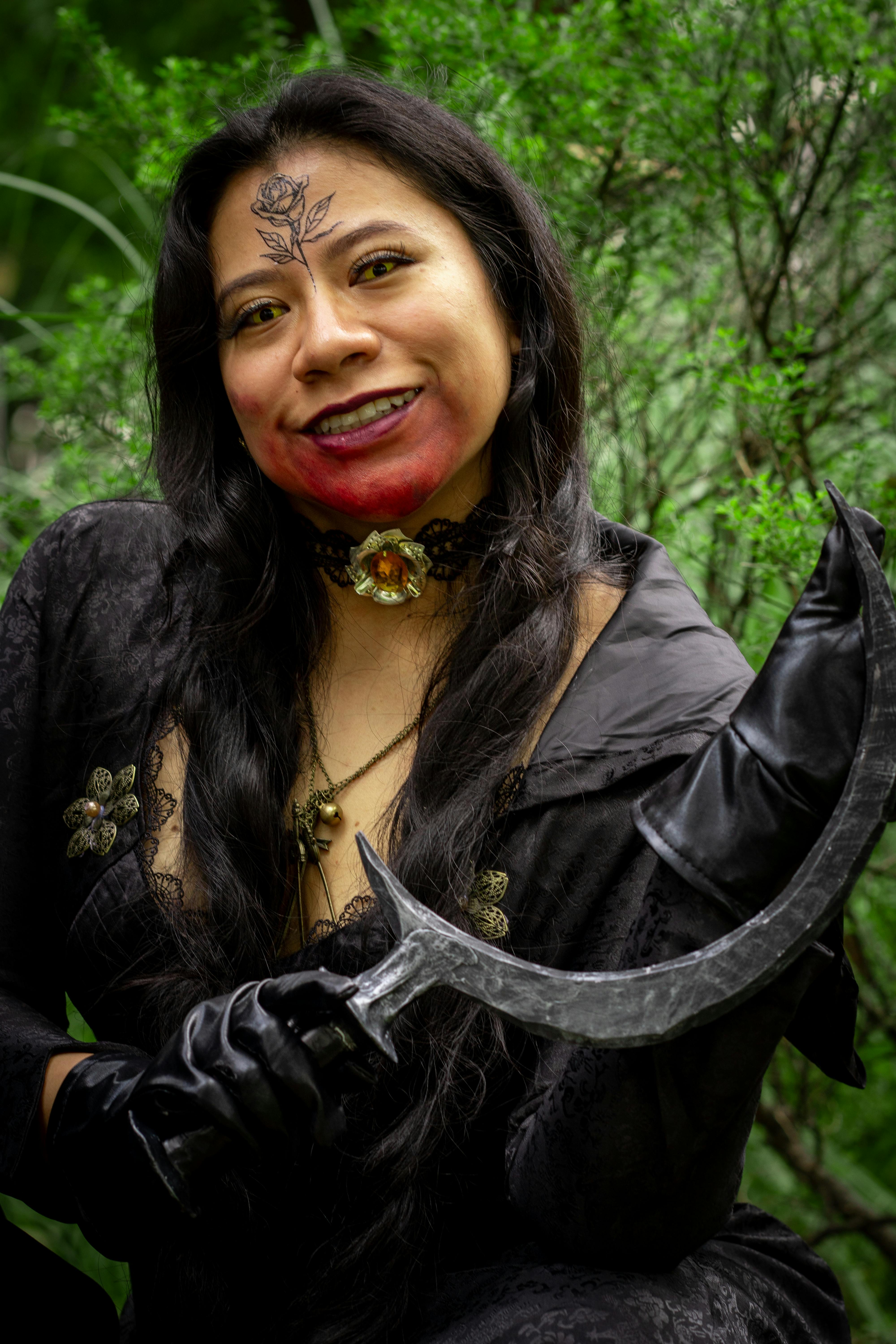 Gothic Cosplay with Sickle Outdoors · Free Stock Photo