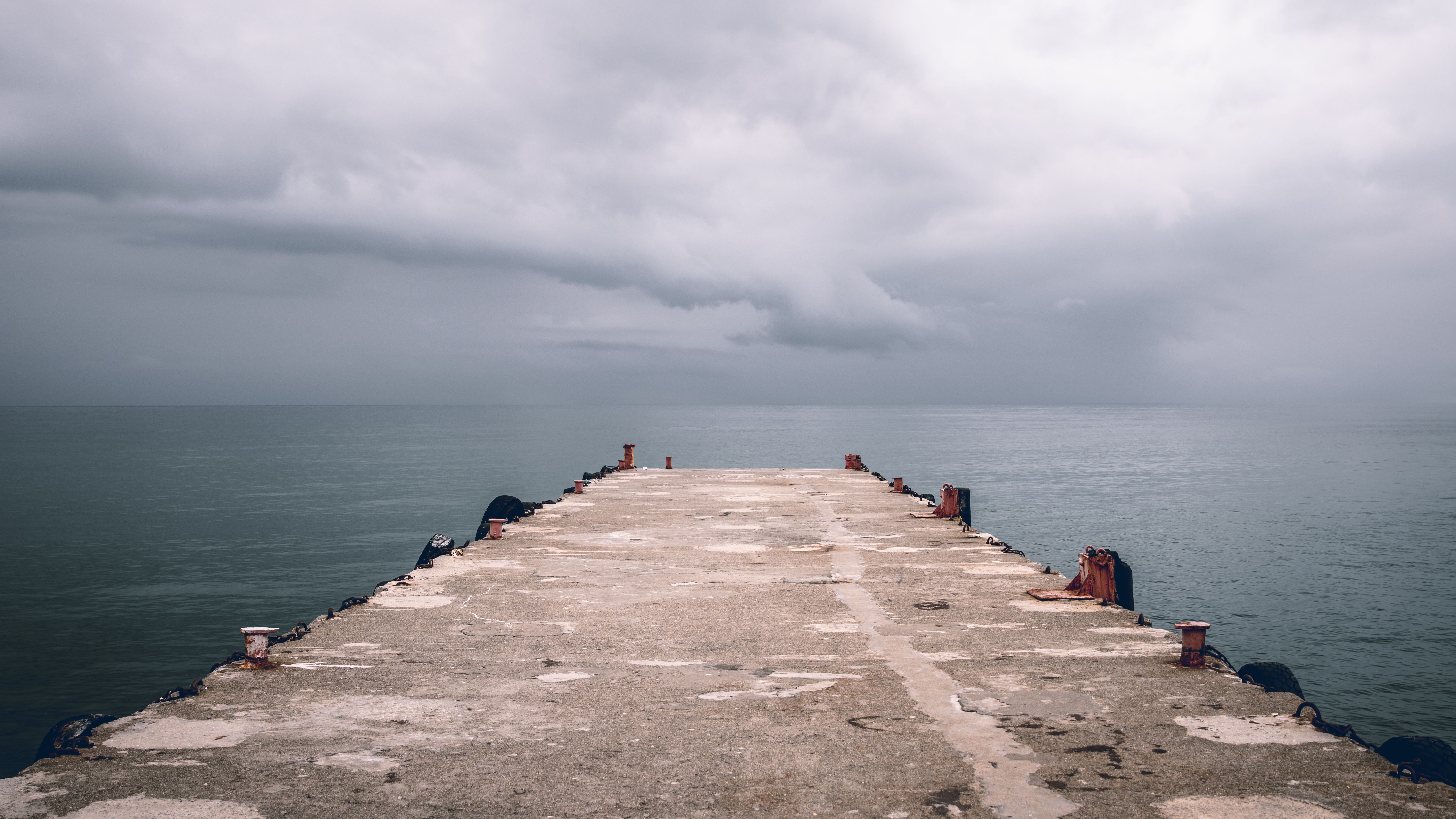 Photo of Concrete Dock Under Cloudy Sky · Free Stock Photo