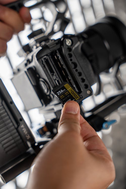 Inserting Memory Card into Professional Camera · Free Stock Photo Inserting Memory Card into Professional Camera · Free Stock Photo
