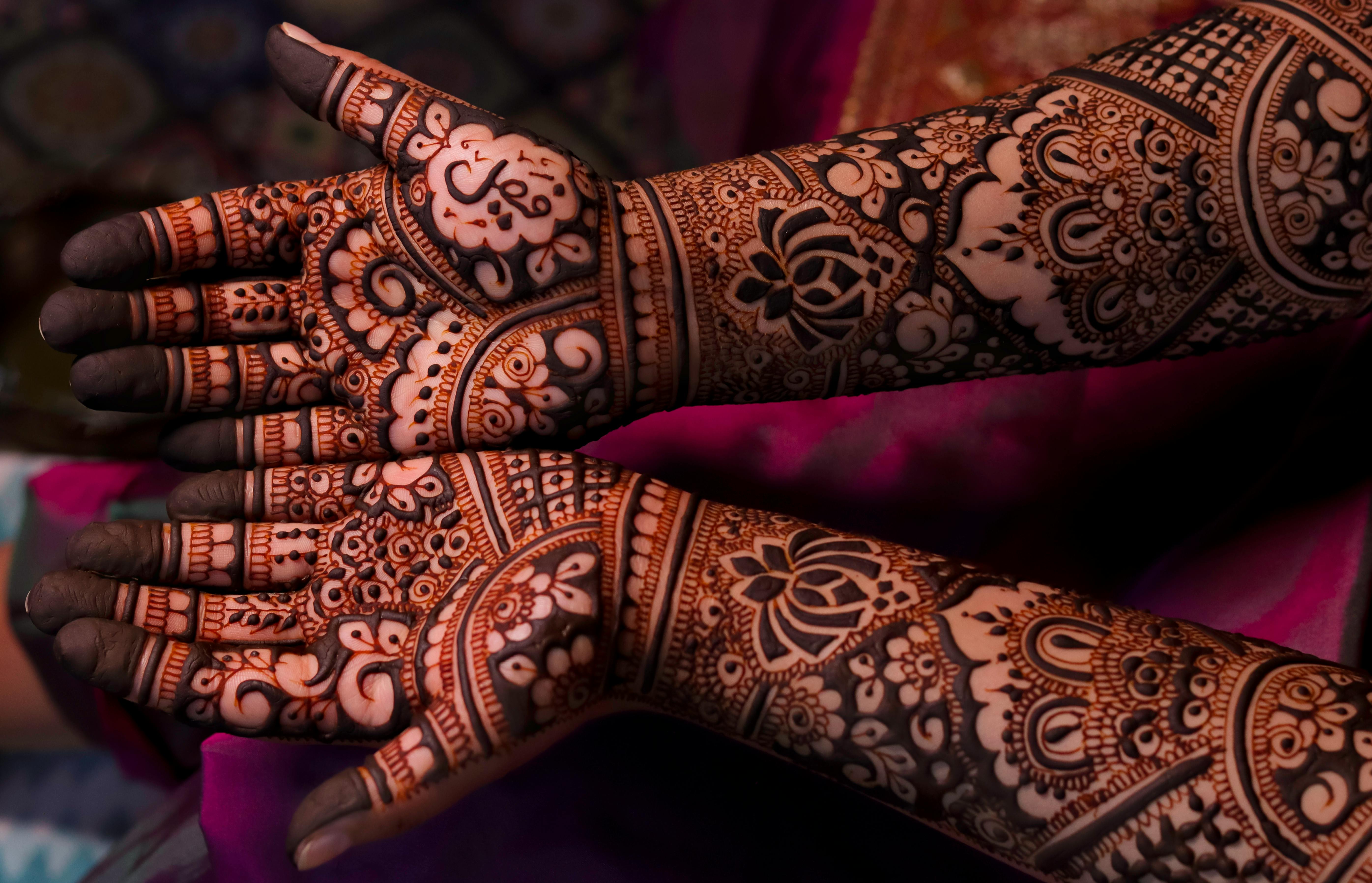 Intricate Henna Designs on Hands · Free Stock Photo