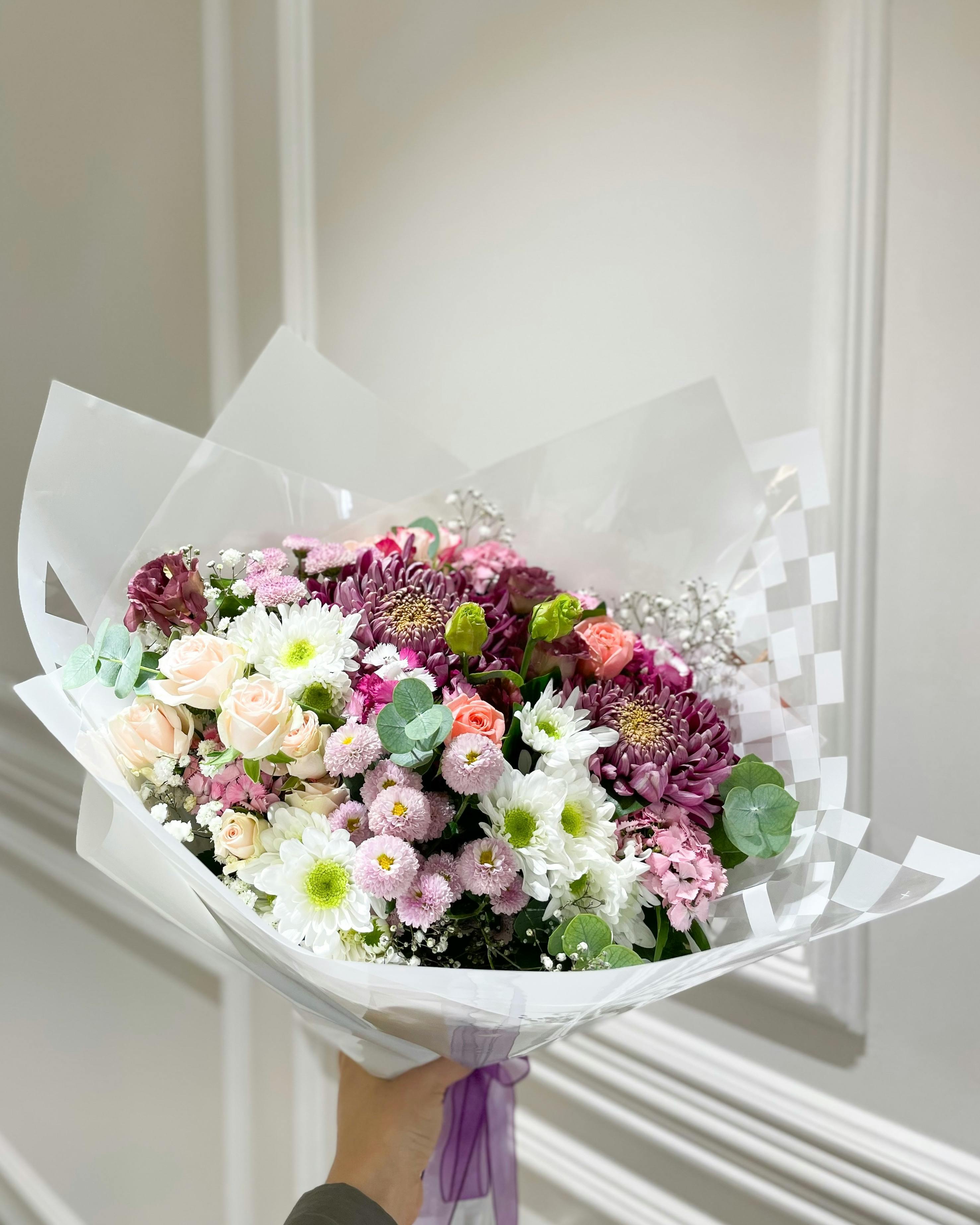 Elegant Mixed Flower Bouquet in Neutral Setting · Free Stock Photo