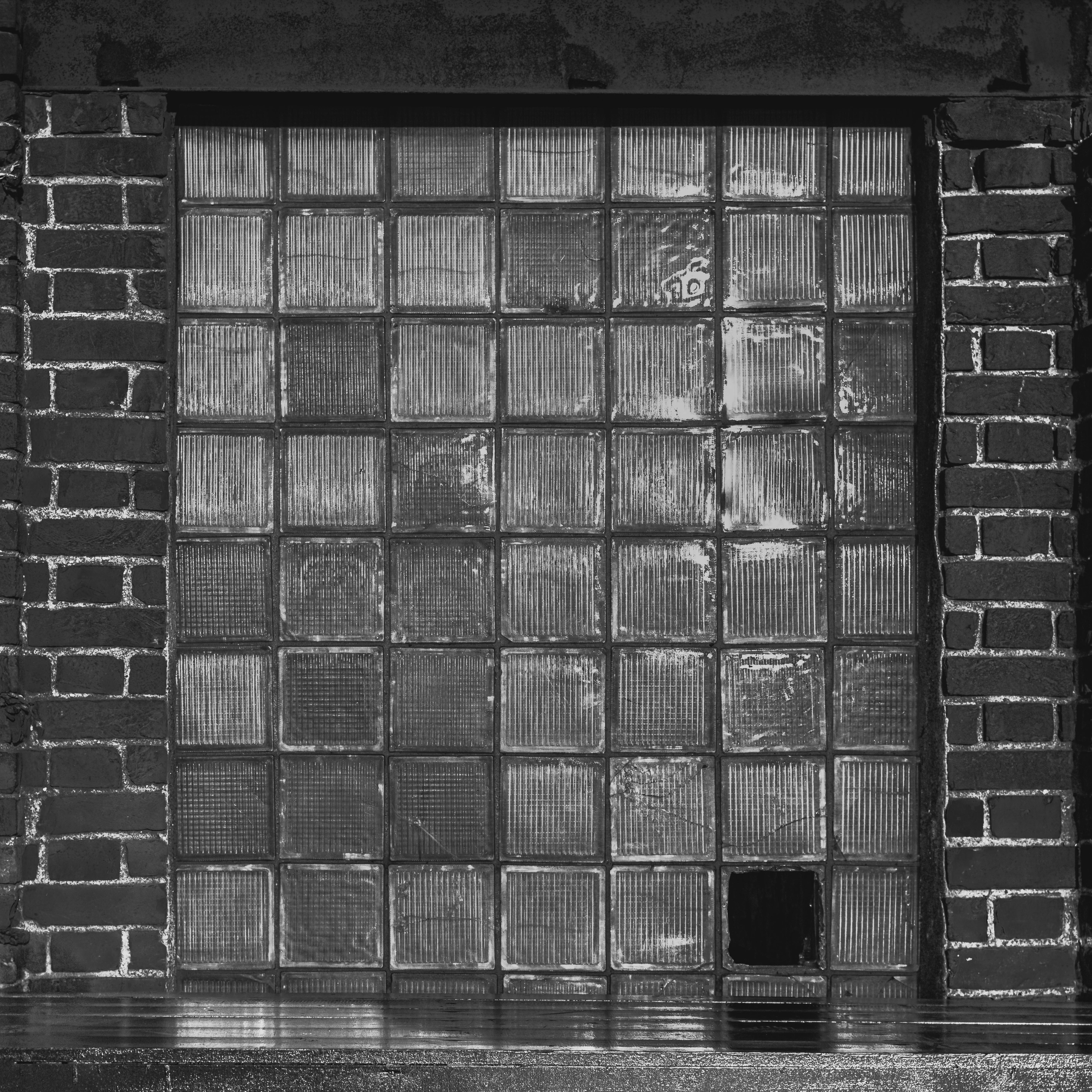 Black and White Glass Block Window in Brick Wall · Free Stock Photo