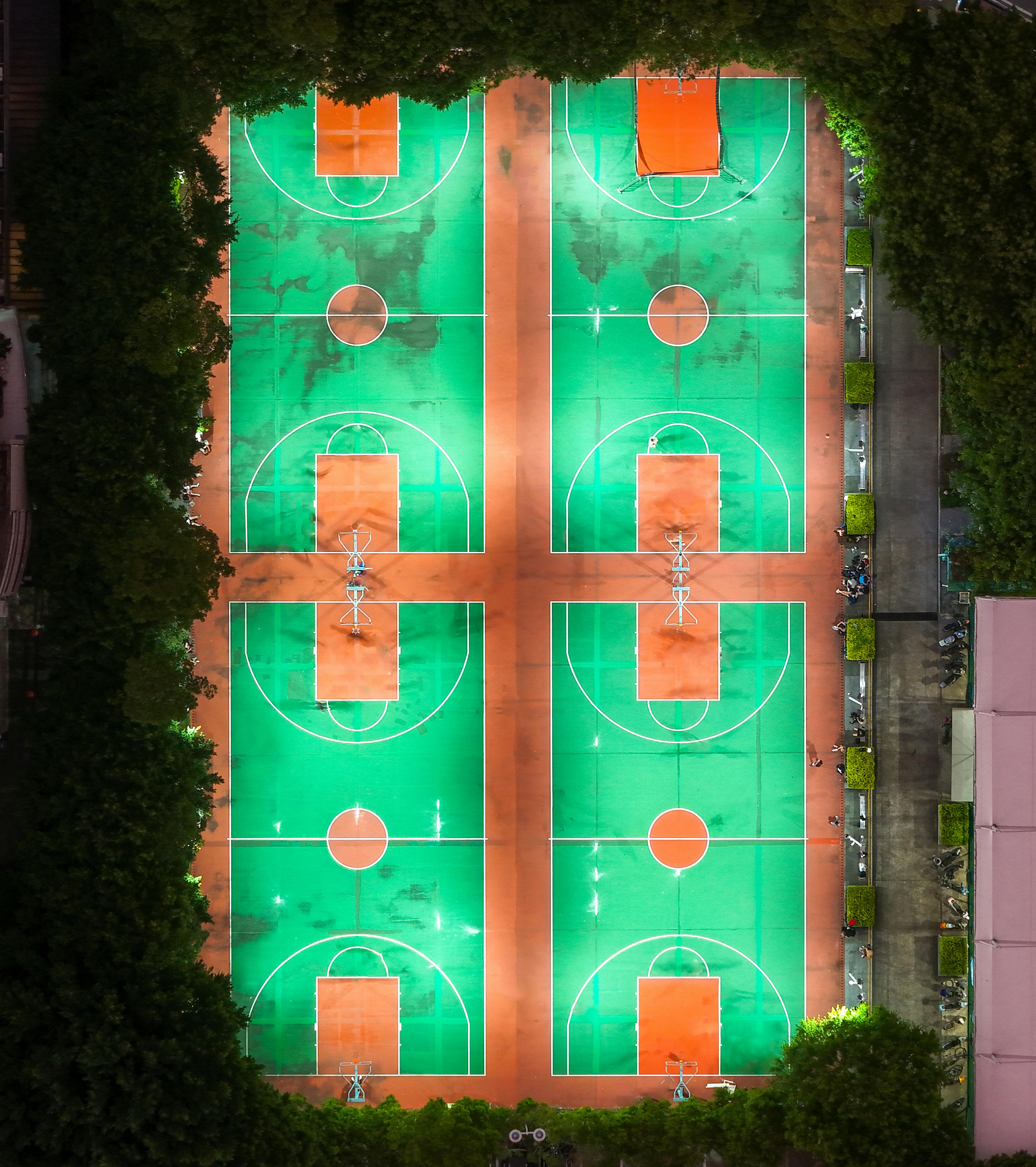 Aerial View of Illuminated Basketball Courts at Night · Free Stock Photo