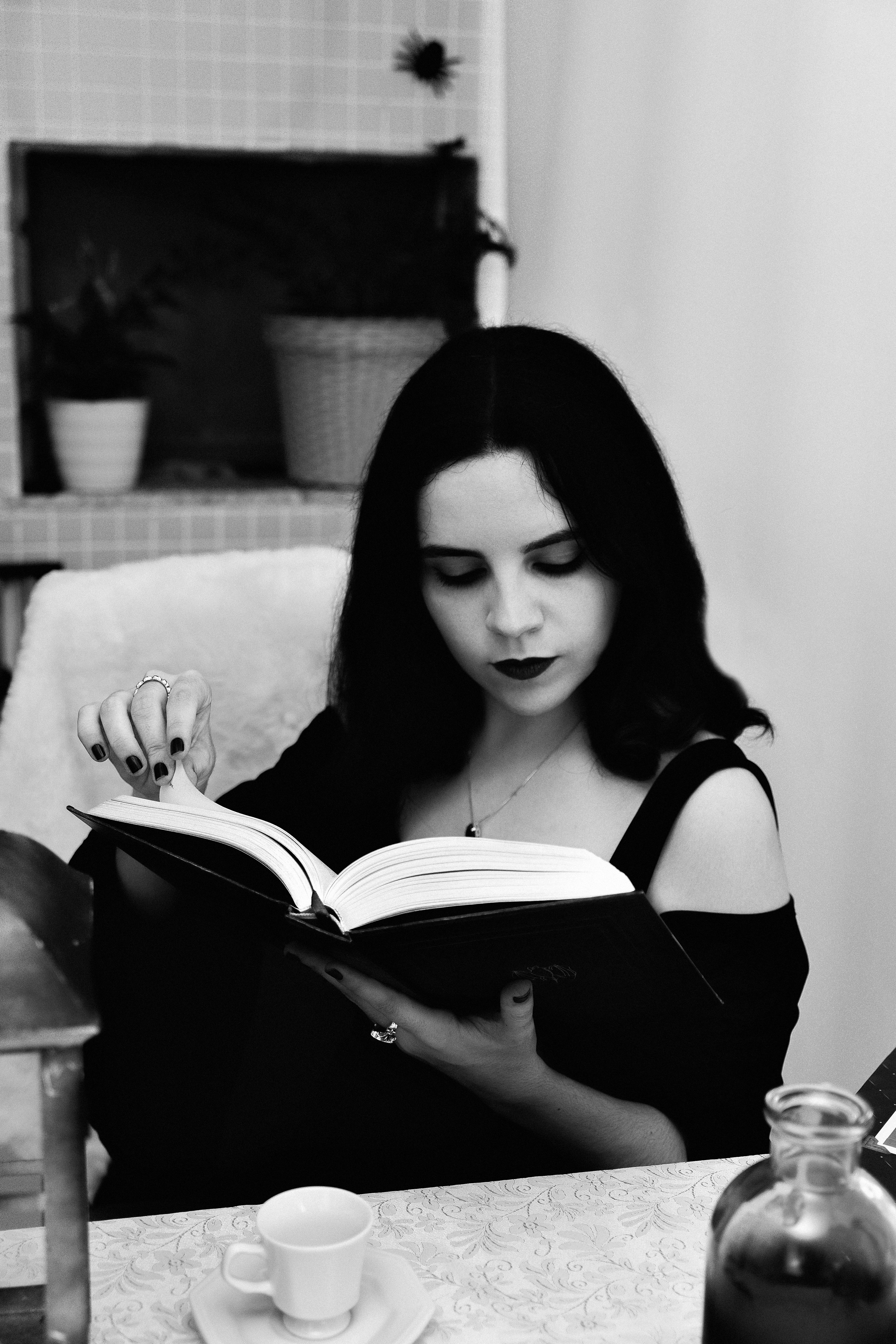 Monochrome Portrait of Woman Reading at Home · Free Stock Photo