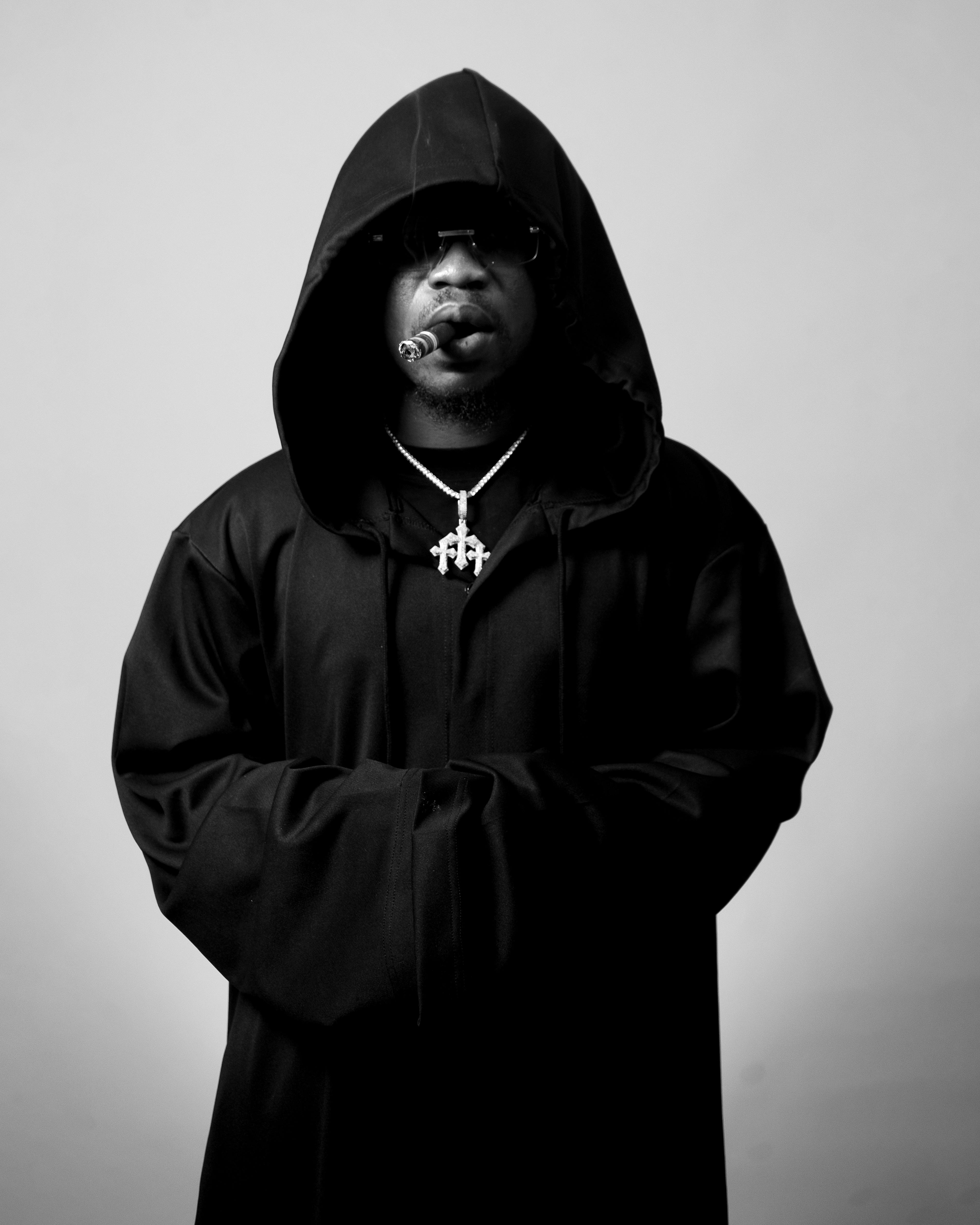 Mysterious Person in Hooded Robe with Cigar · Free Stock Photo