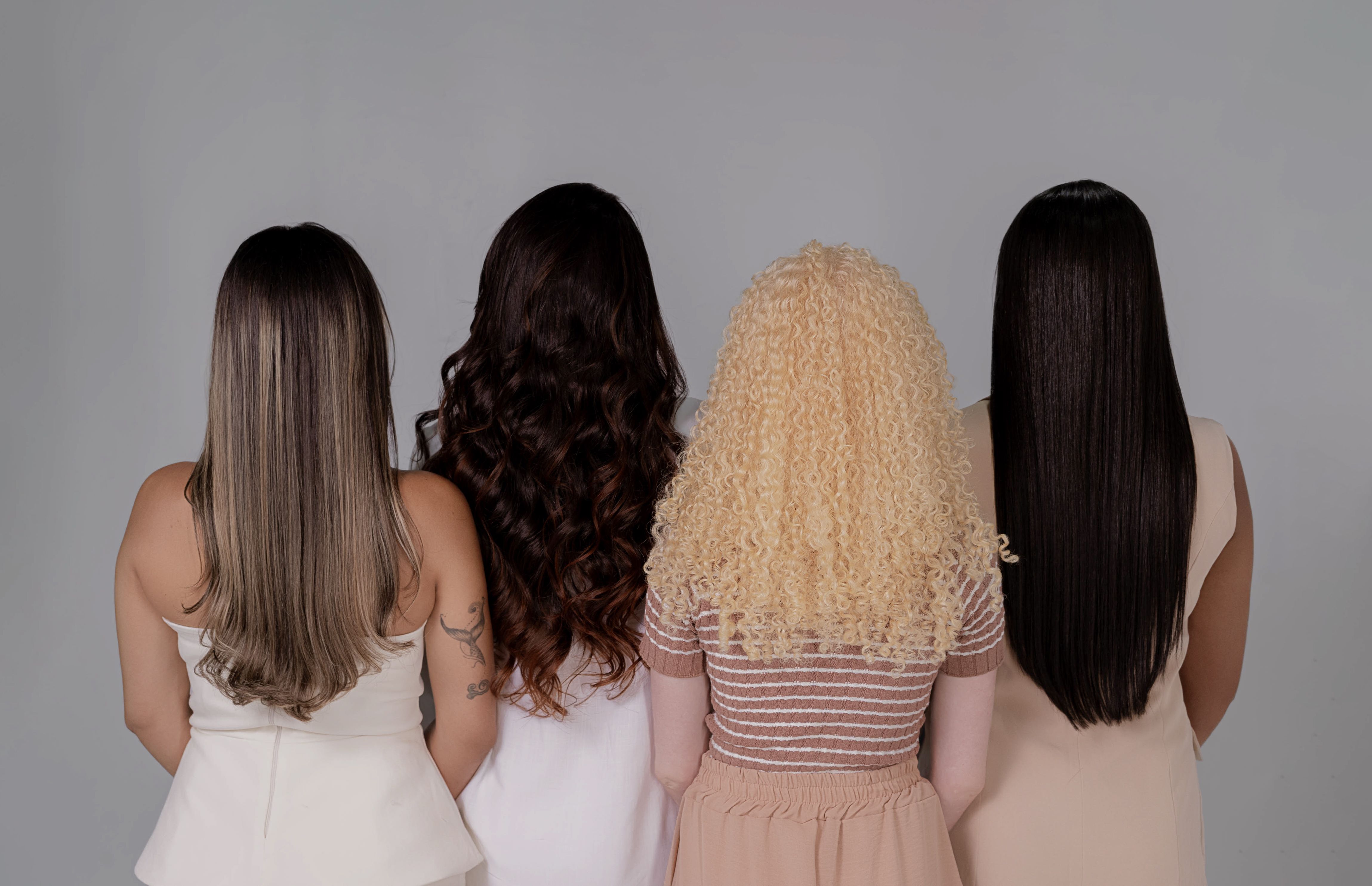 Diverse Hairstyles on Four Women From Behind · Free Stock Photo
