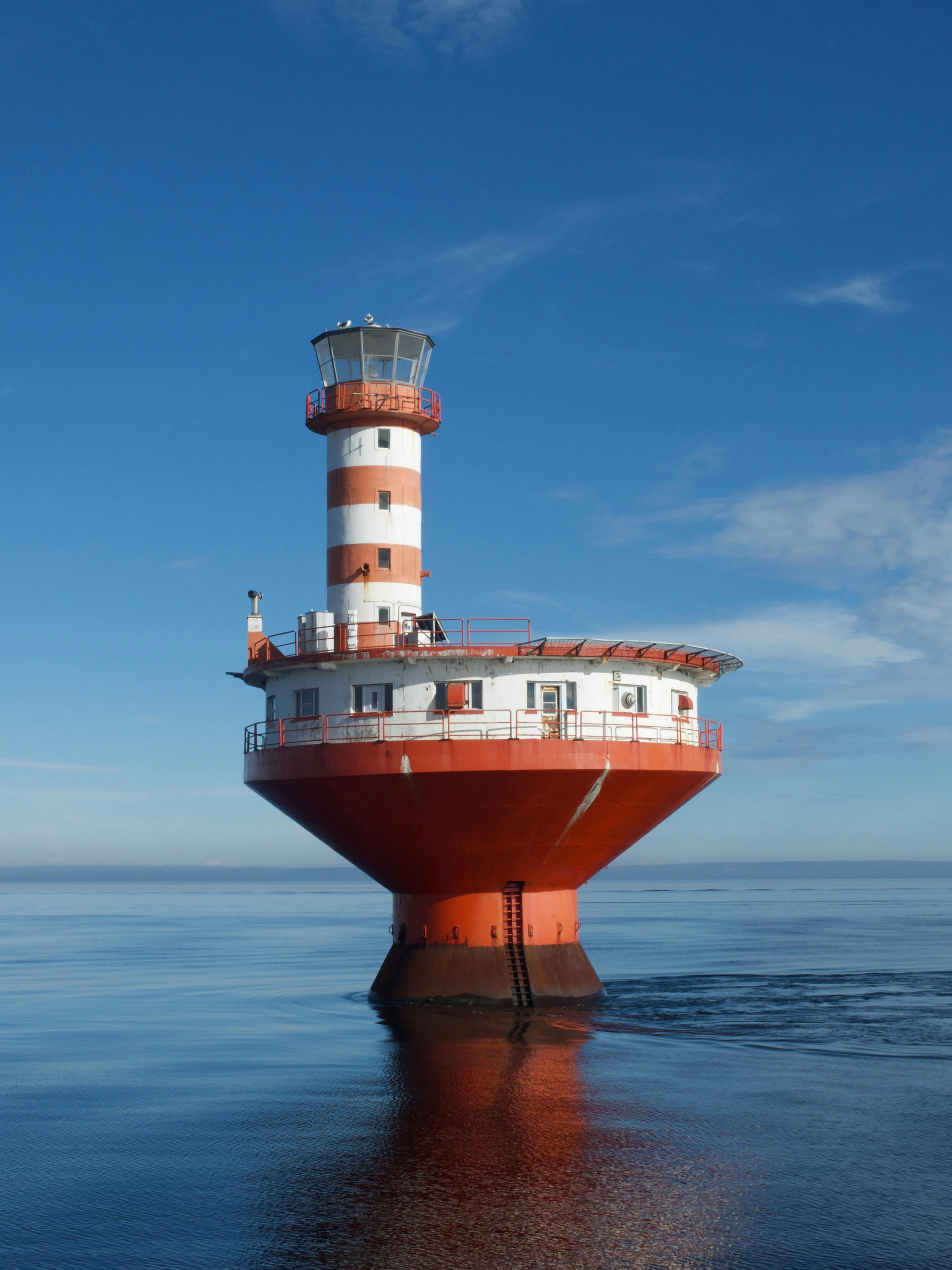 Lighthouse in Sea · Free Stock Photo